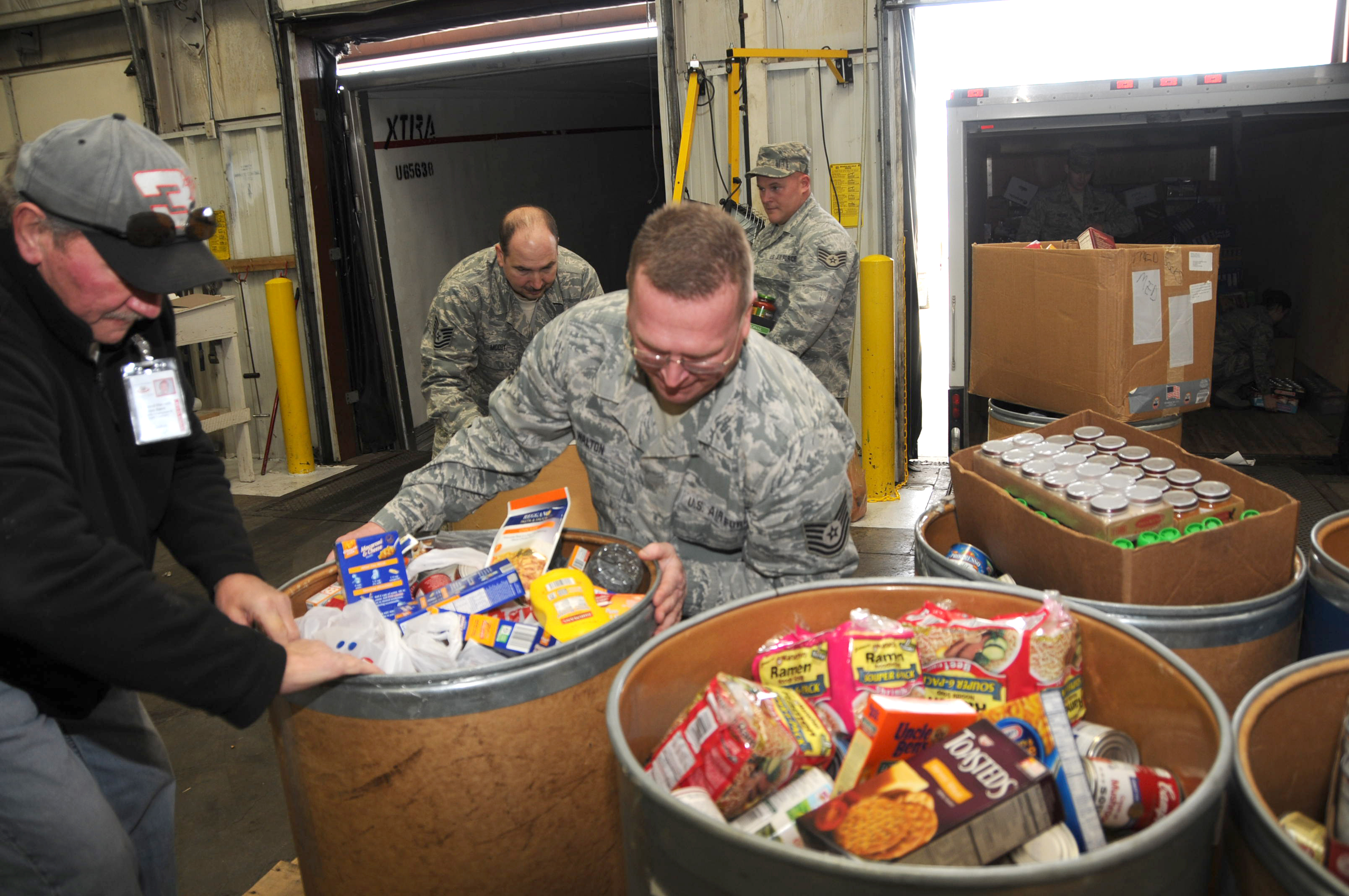 Airman deliver food to local food bank