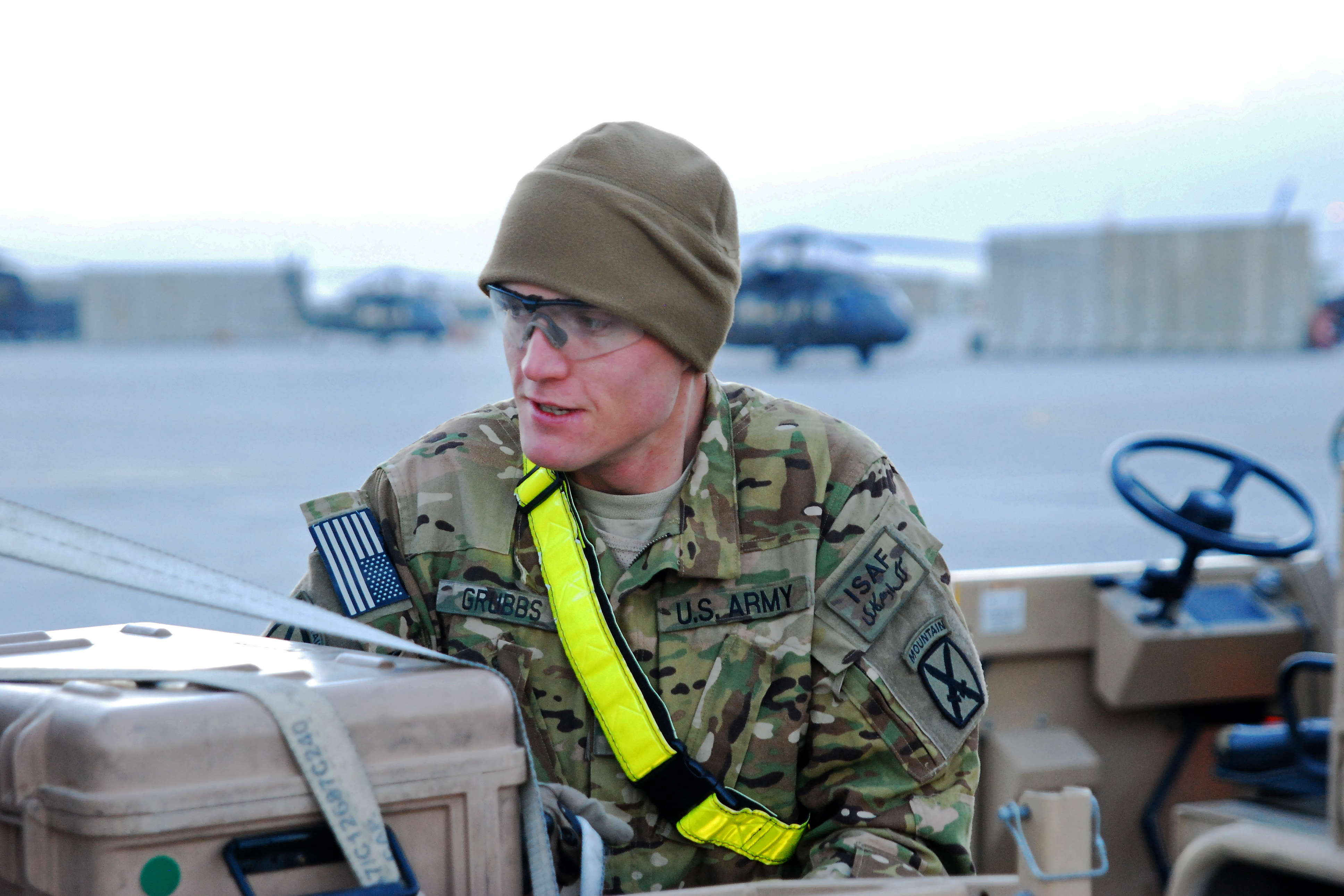 U.S. Spc. Jacob Grubbs secures equipment used to download helicopters ...