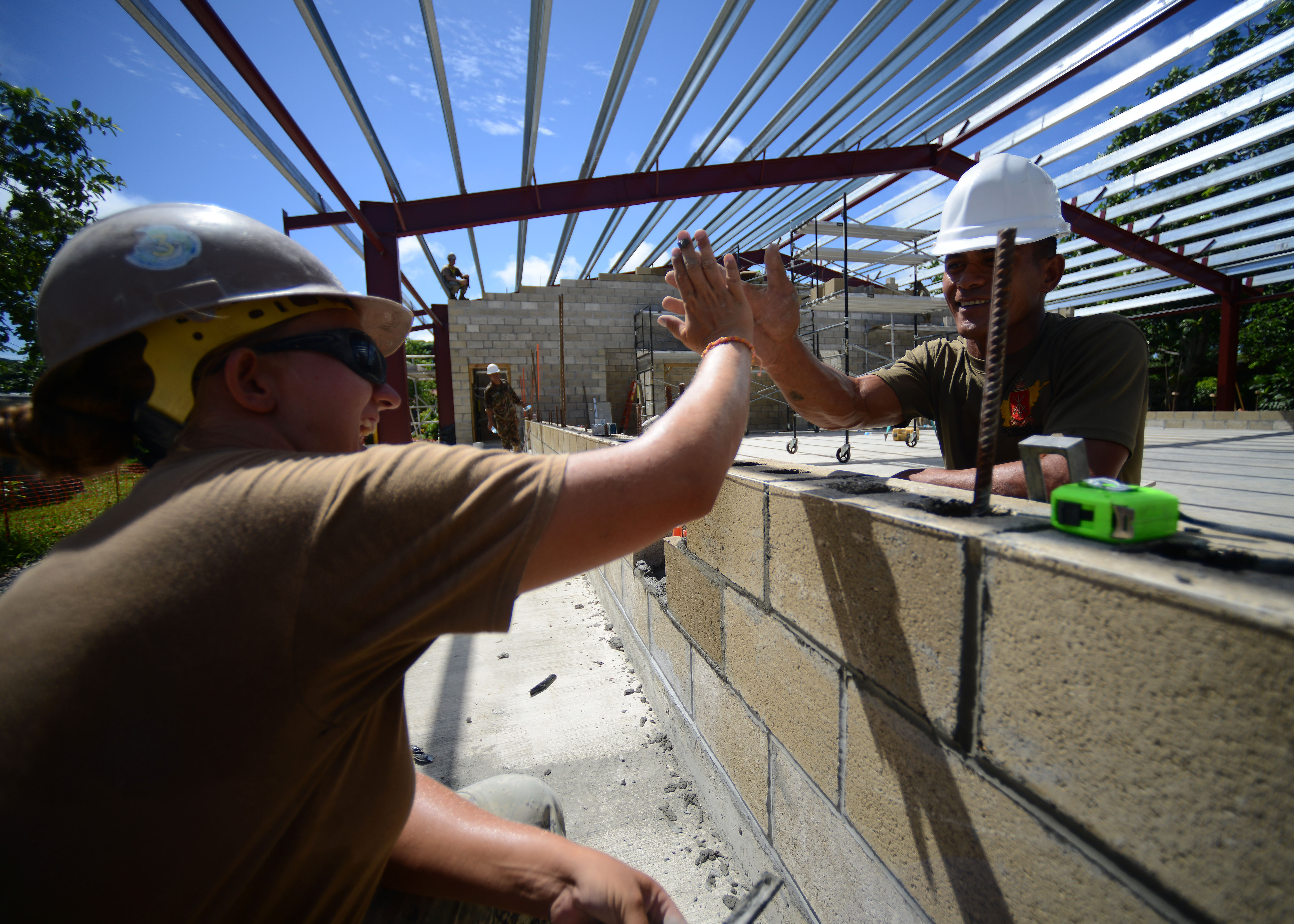 U.S. Navy Petty Officer 3rd Class Paige Abernathy, left, and Tongan Lance Cpl. Saili Laisolo ...