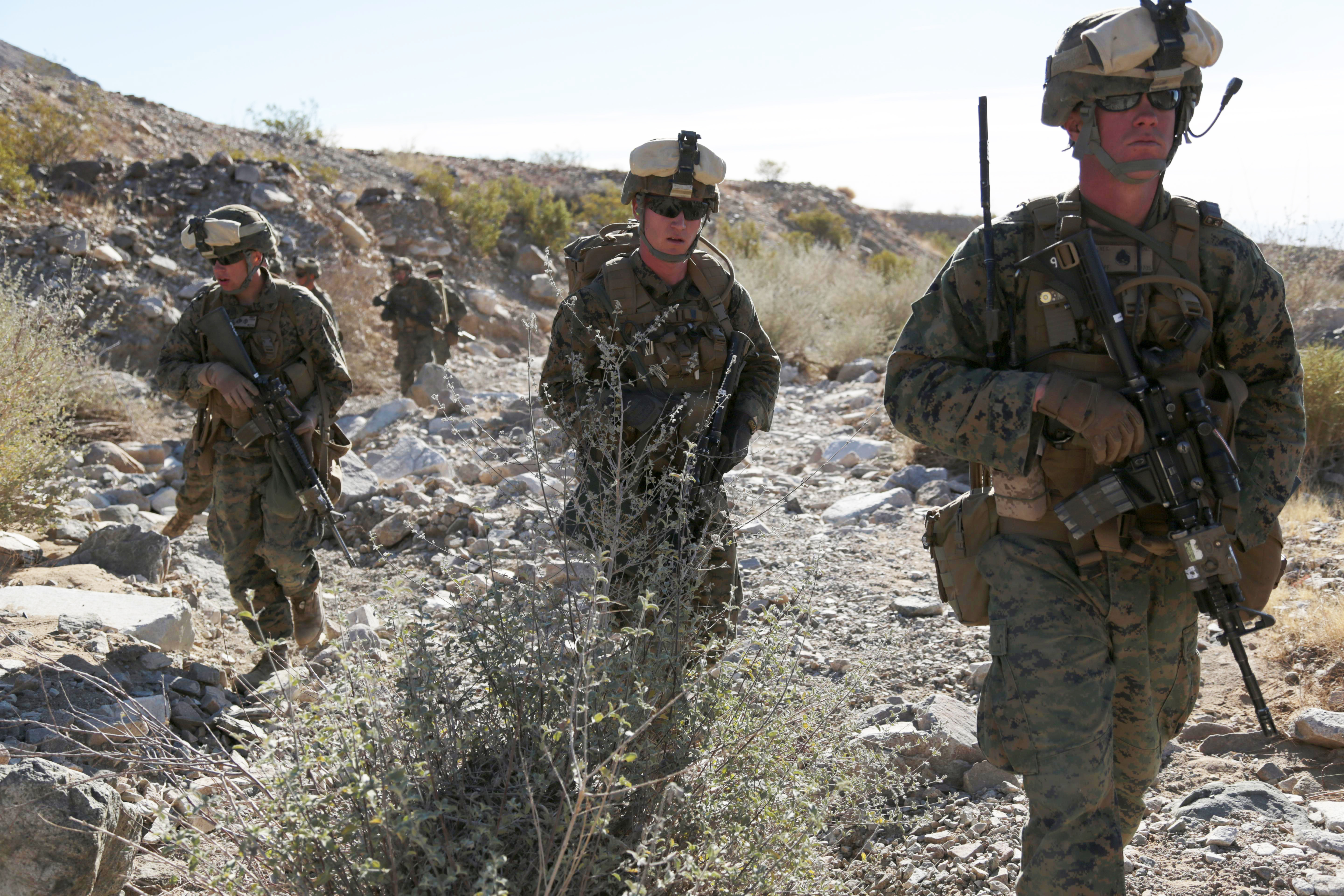 Marines maneuver through trenches during Exercise Iron Fist 2013 at ...