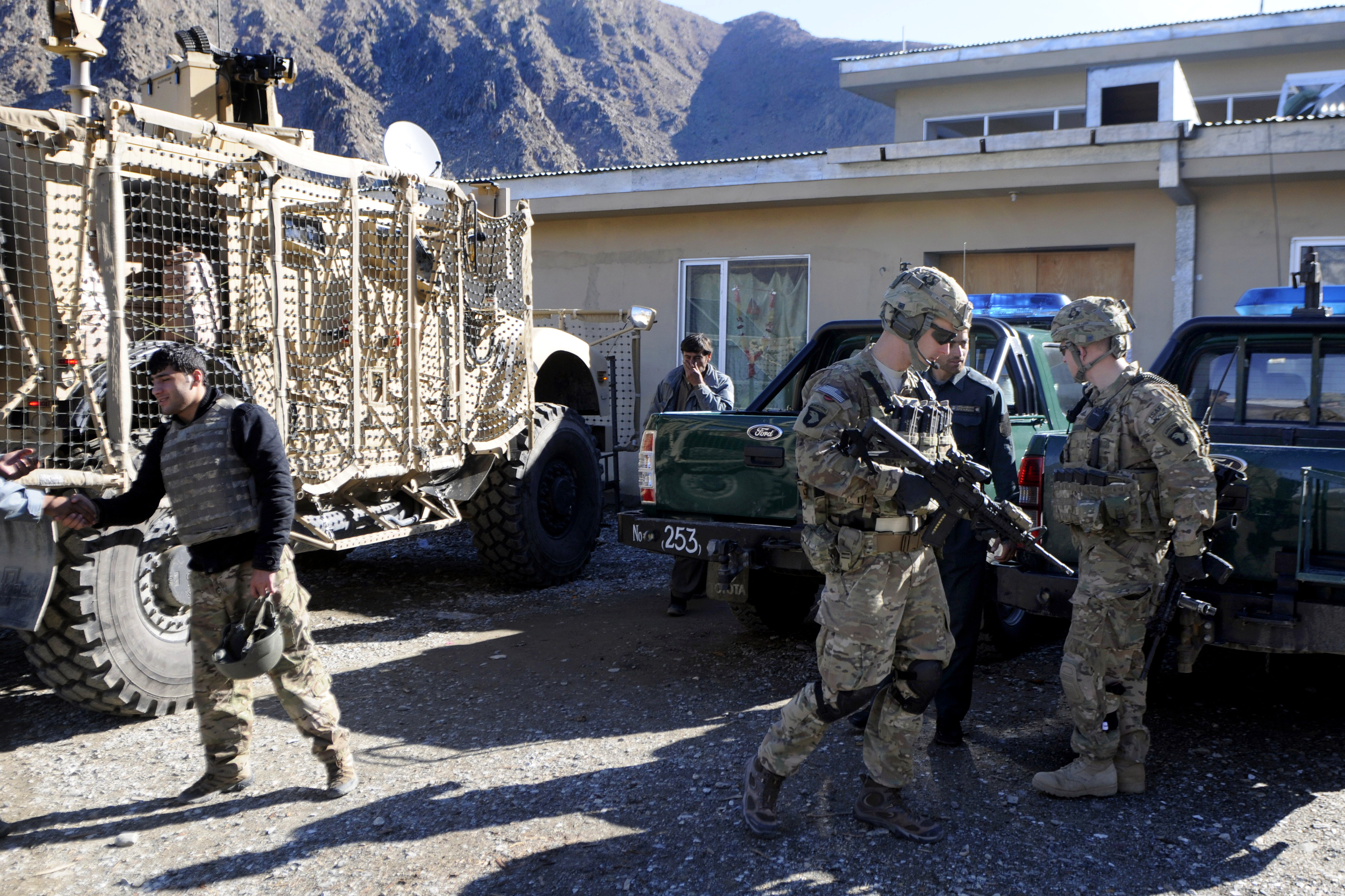 U.S. soldiers prepare their vehicles on Forward Operating Base Joyce ...