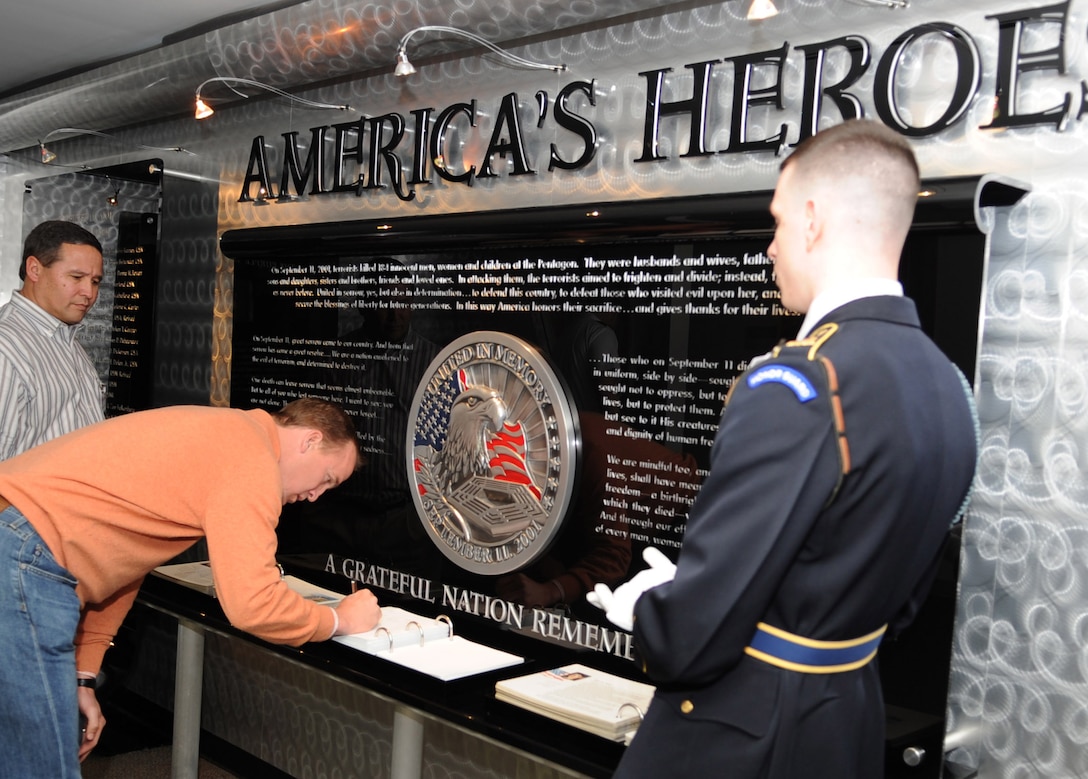 Peyton Manning, Denver Broncos quarterback, signs the guest book at the ...