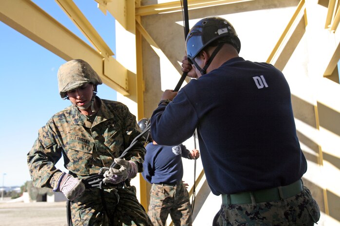 A recruit of Company M, 3rd Recruit Training Battalion, begins to ...