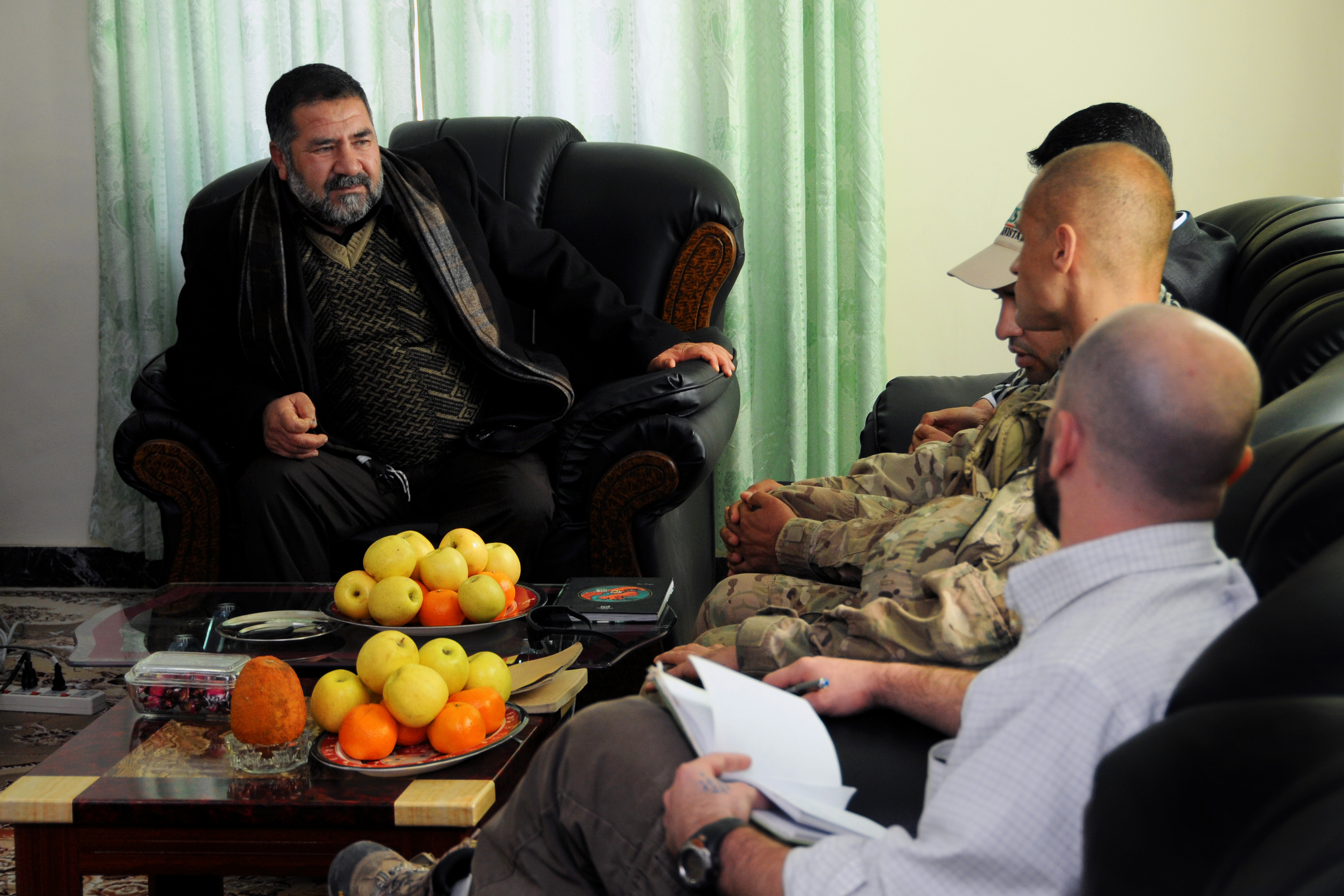 Farah Province Deputy Gov. Mohammed Yunis Rasooli, left, discusses ...