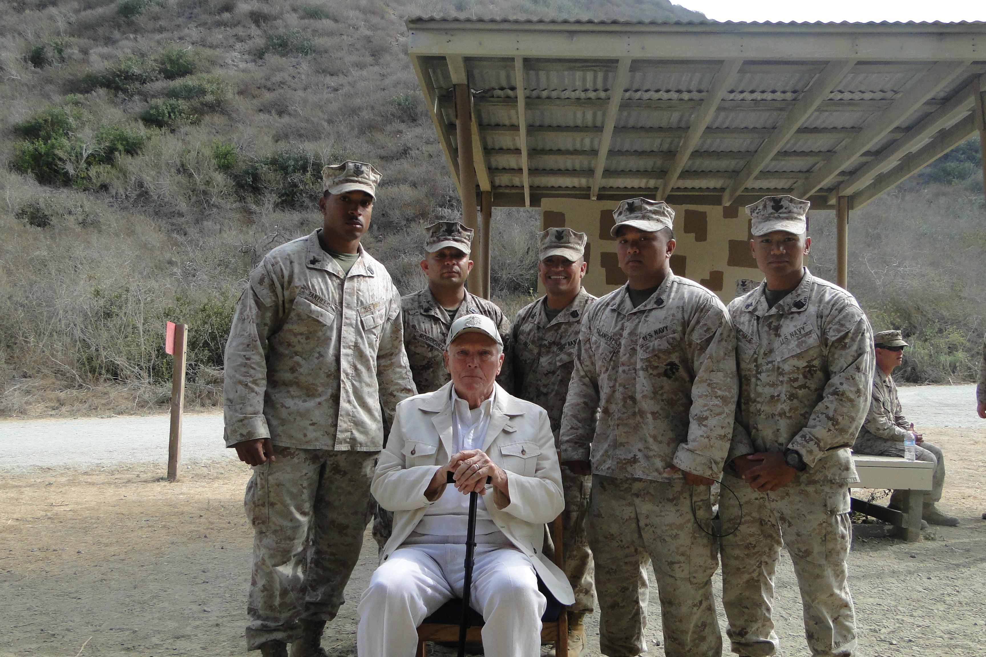 Staff poses with LtCol (ret) McGruder