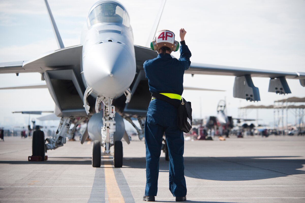 Hand signals: Art ensures safe aircraft operations > Nellis Air Force ...
