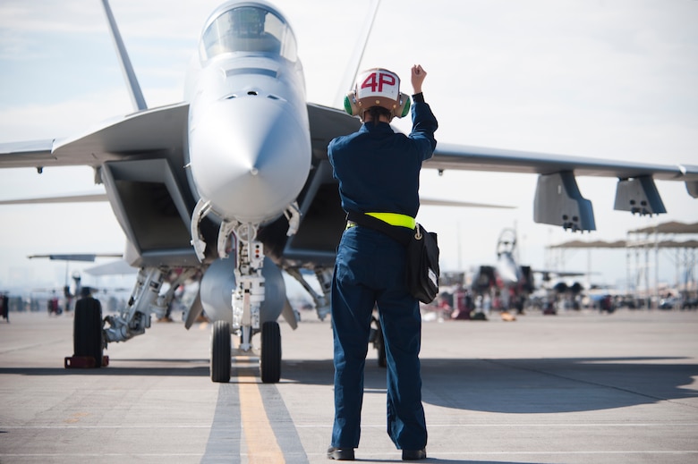 Hand signals: Art ensures safe aircraft operations > Nellis Air Force ...