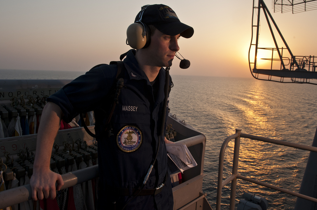 U.S. Navy Intelligence Specialist 3rd Class Ross Massey stands on ...
