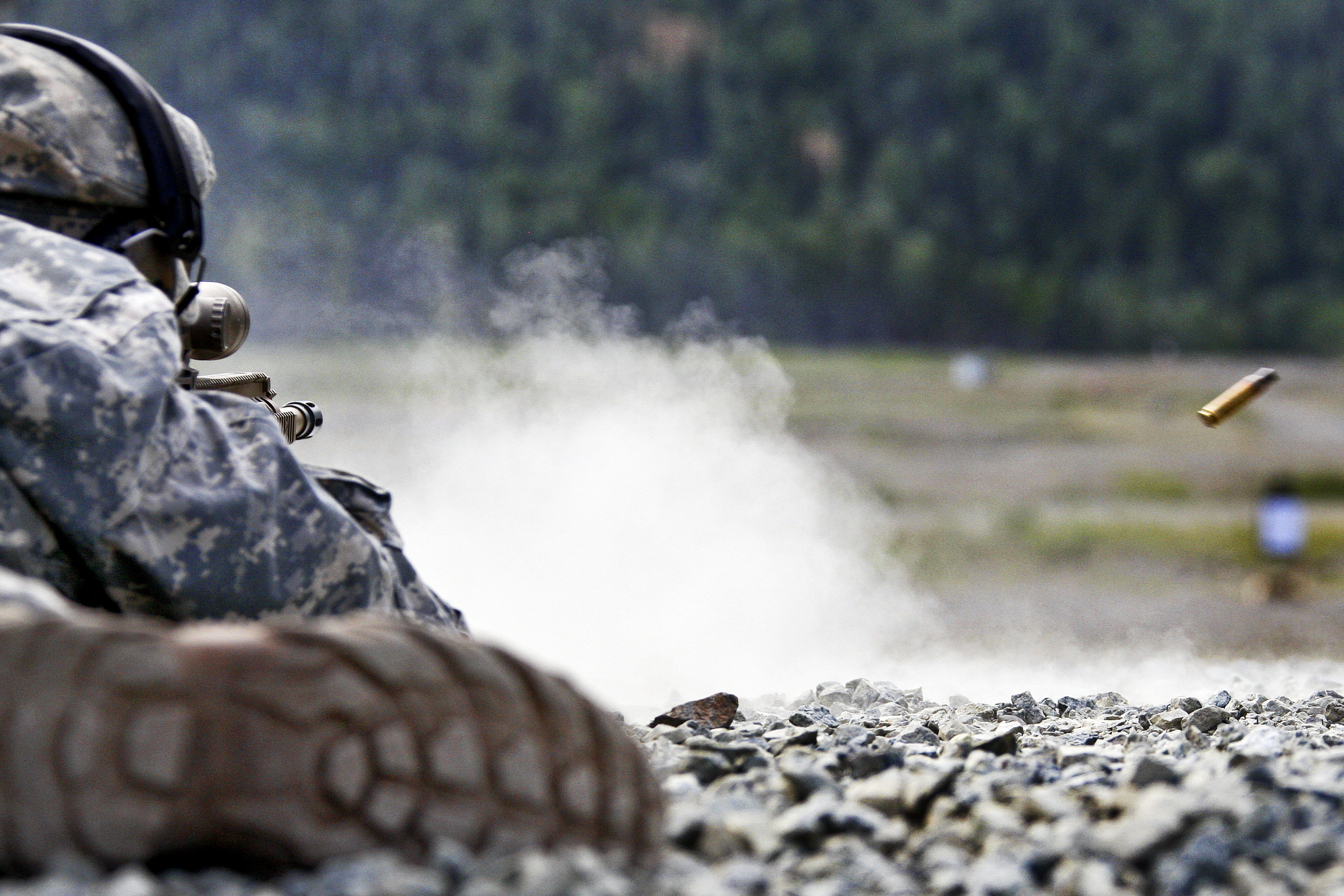 Army Spc. Andrew Vrooman engages targets during the M110 semi-automatic ...