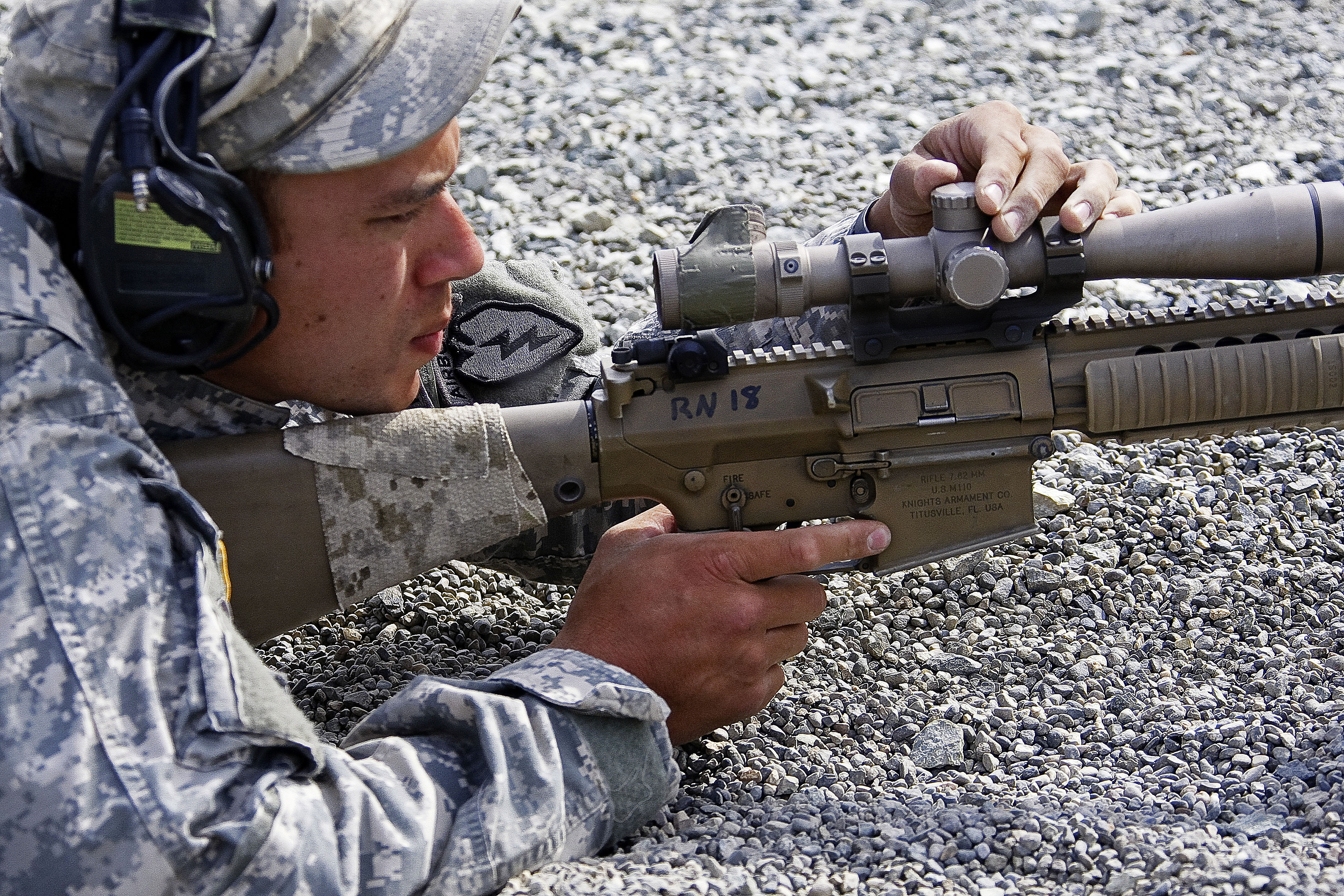 Army Cpl. Jonathan Taylor adjusts the windage and elevation on his M110 ...