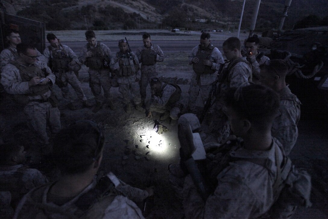 “Fighting Thirteenth” flexes muscles during PMINT Exercise