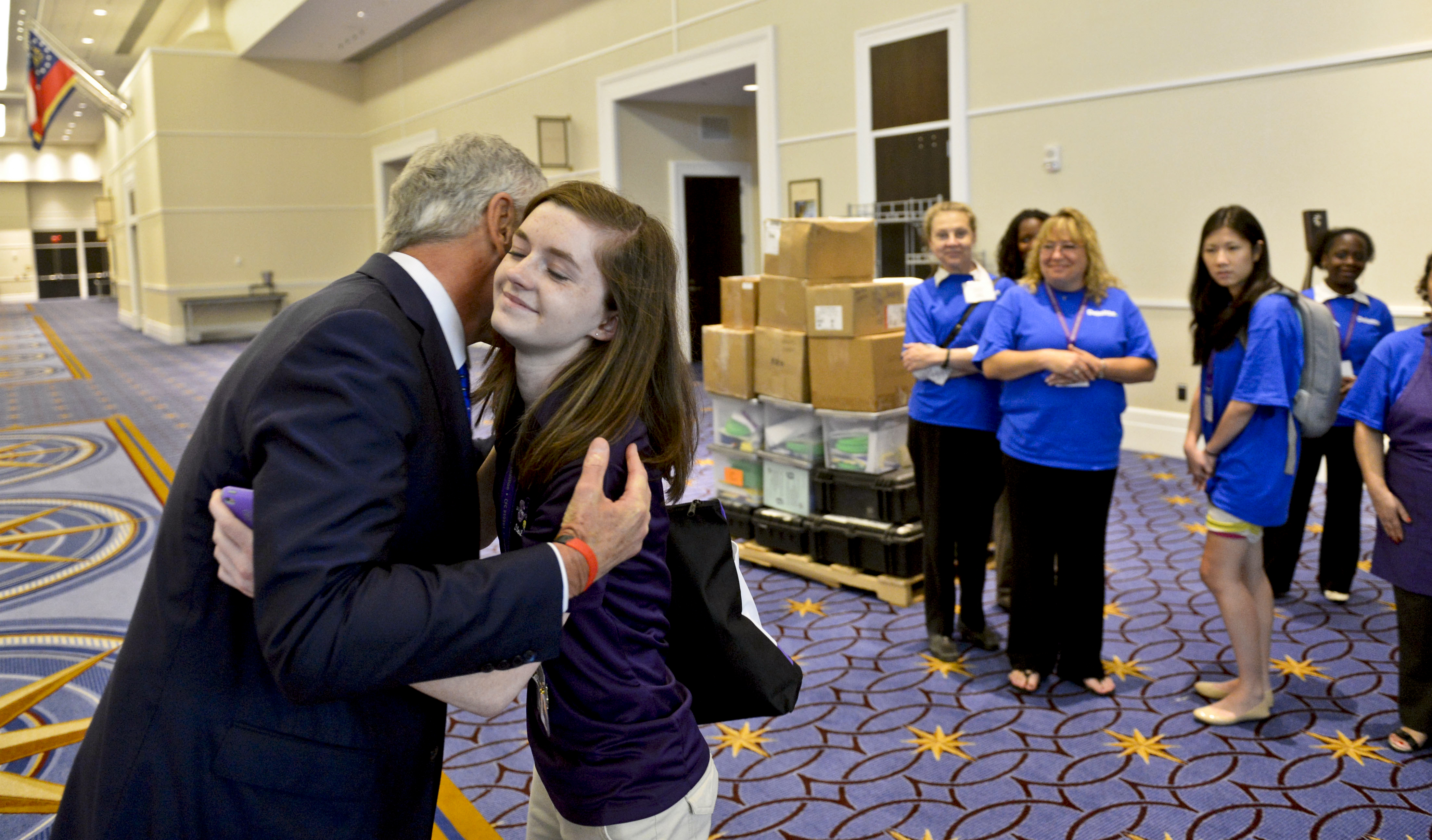 Rebekah Greer, a high school senior from Steilacoom, Wash., gets a hug ...