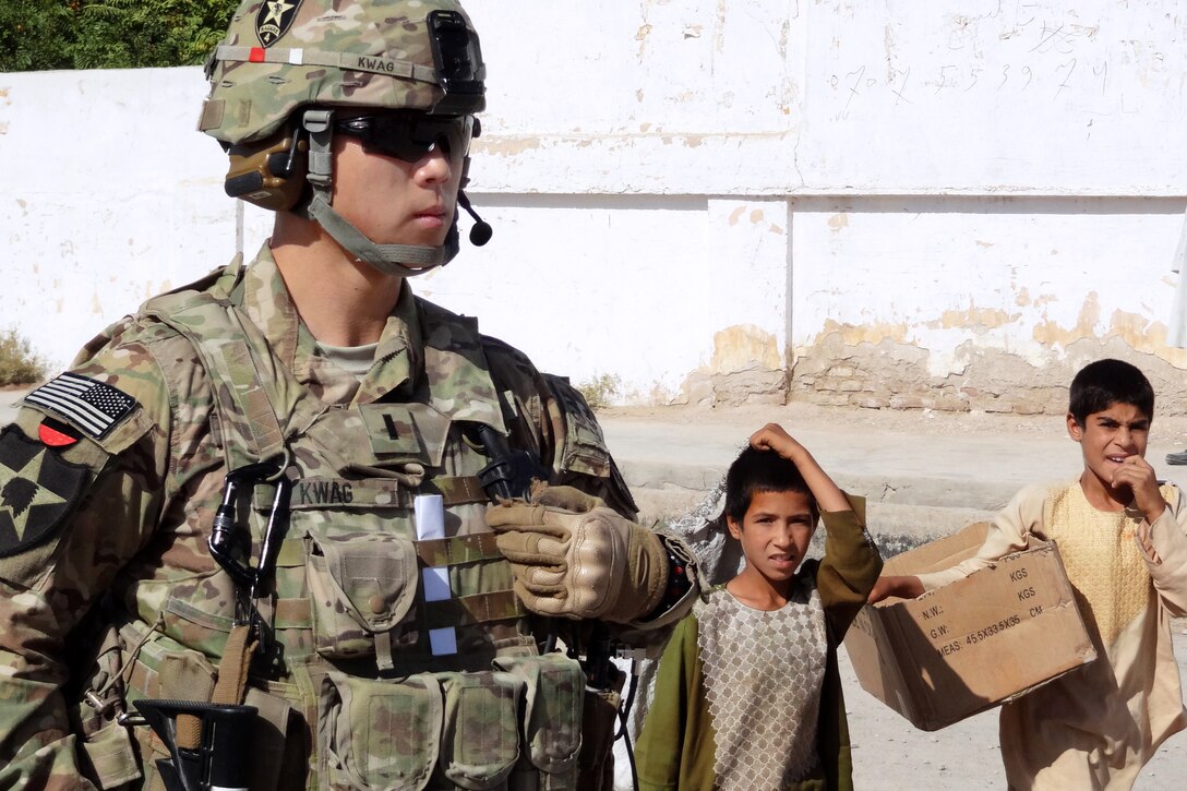 U.S. Army 1st Lt. Eugene Kwag patrols back to Forward Operating Base Farah after a meeting at ...