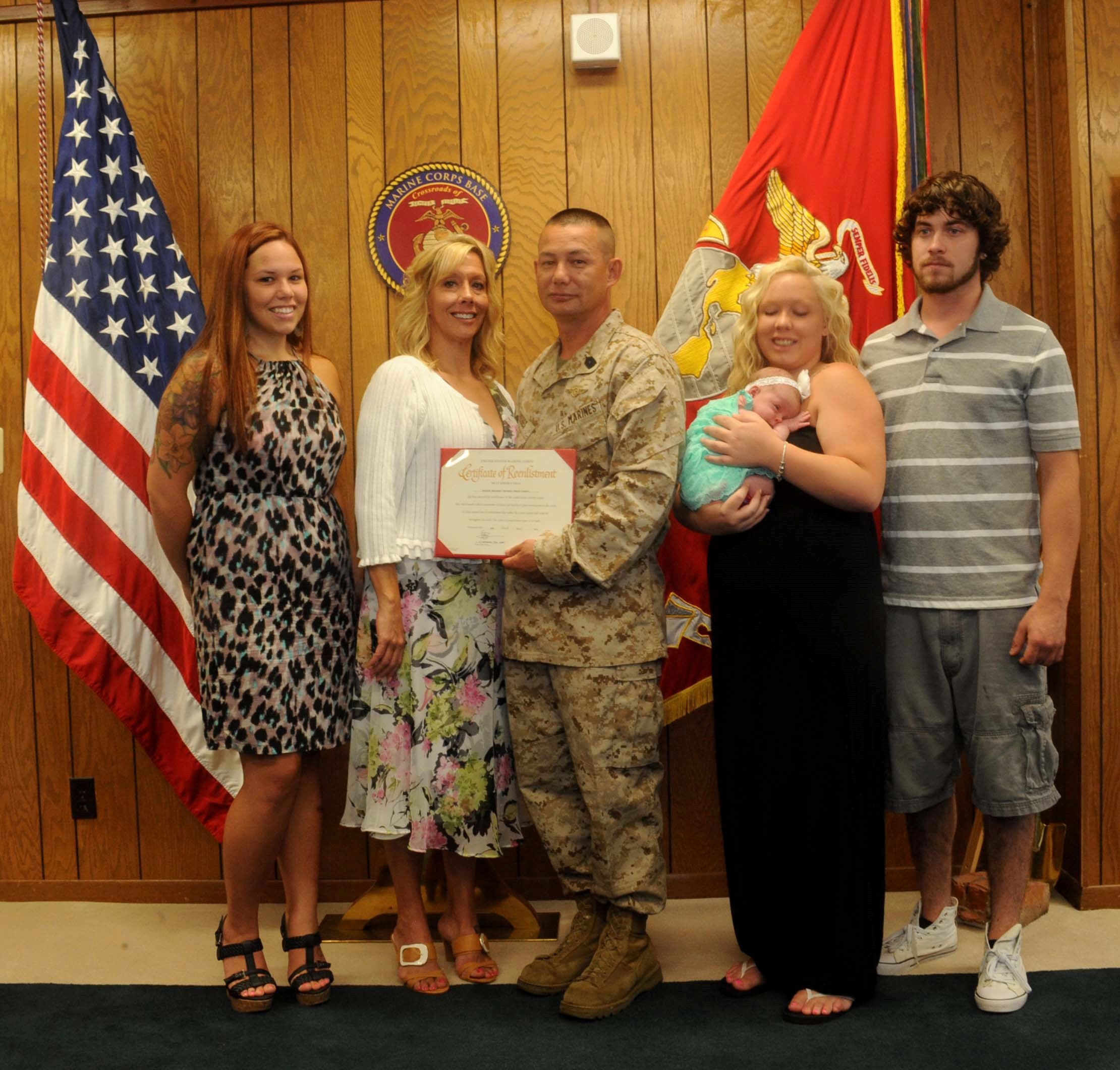 Master Sgt. Anthony Forbes poses for a picture with his family after re ...