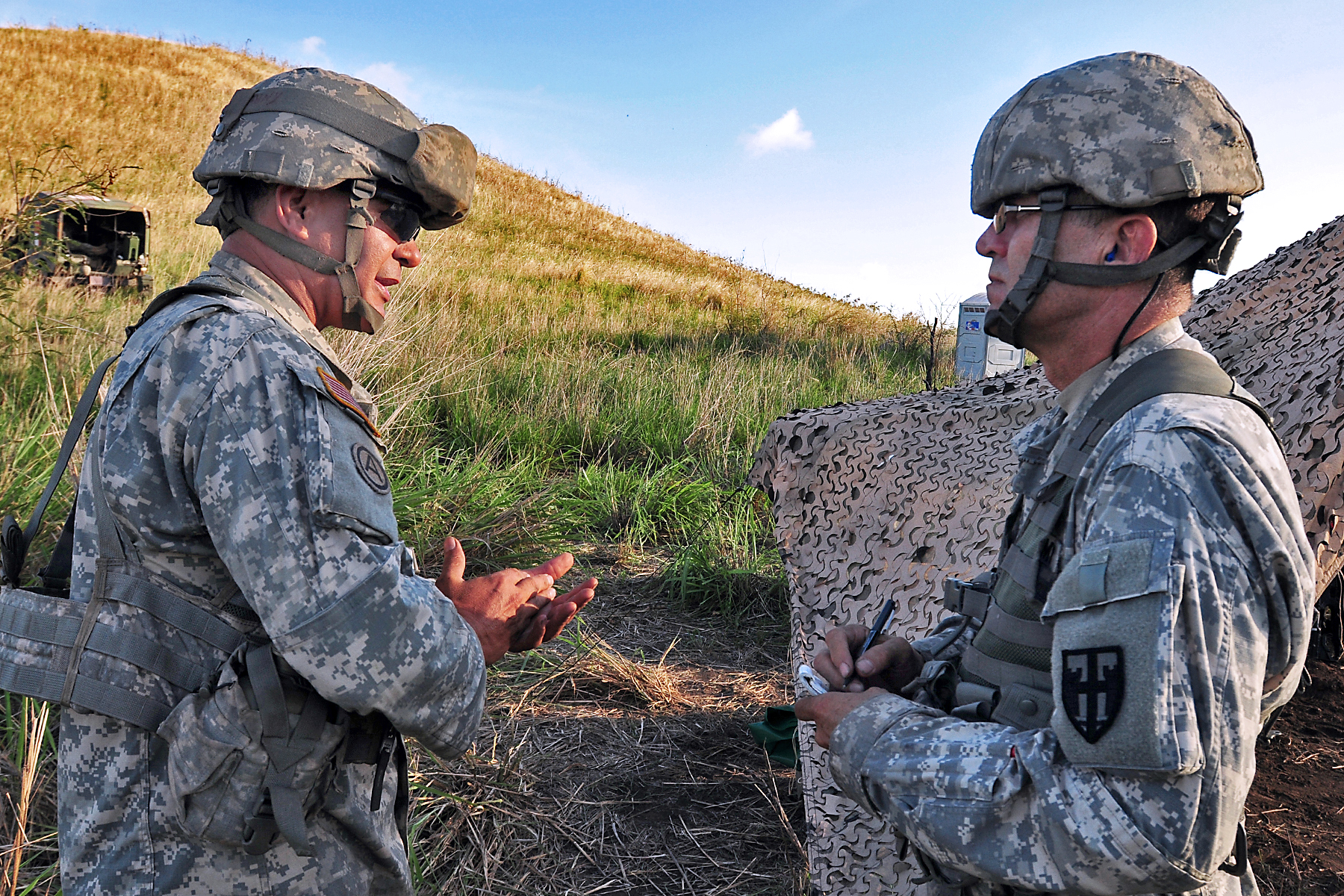 Army Sgt. 1st. Class Danny Garcia, left, talks with Army Sgt. Jose ...