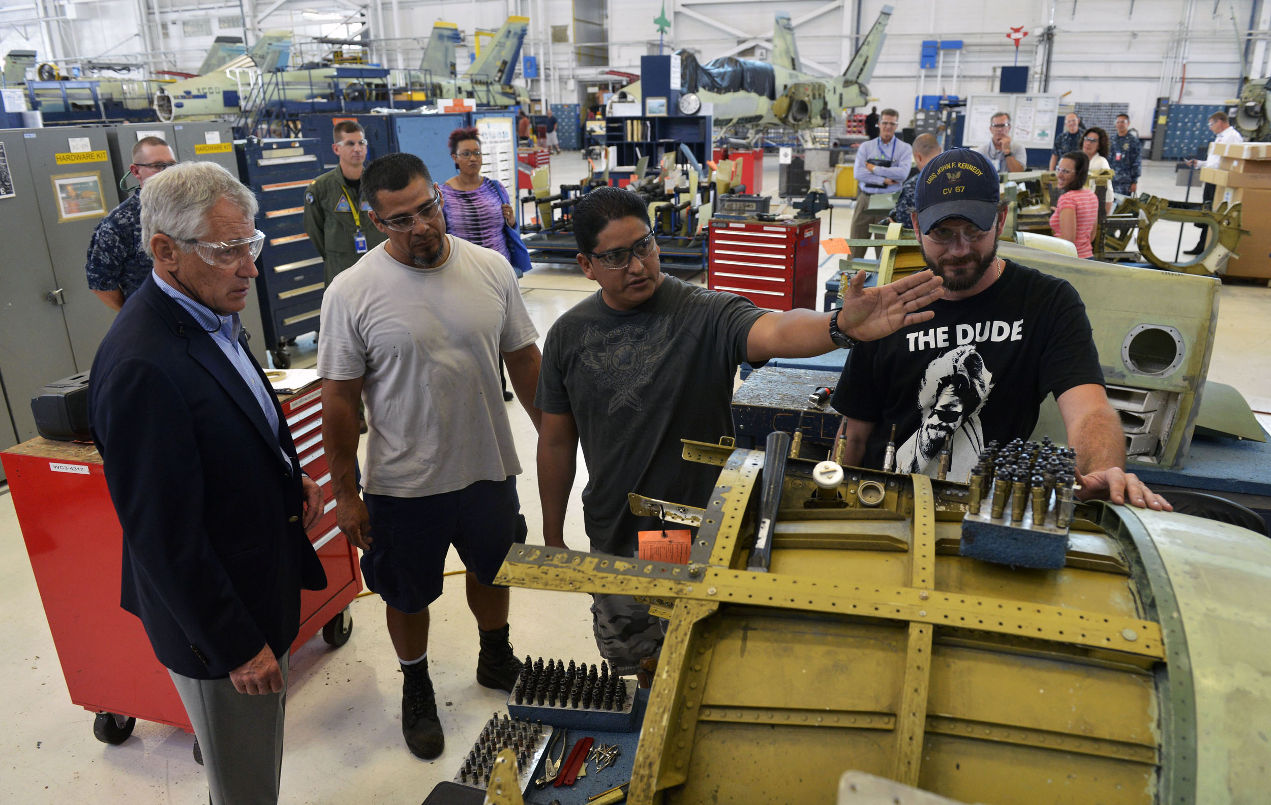 Defense Secretary Chuck Hagel chats with civilian employees who repair ...