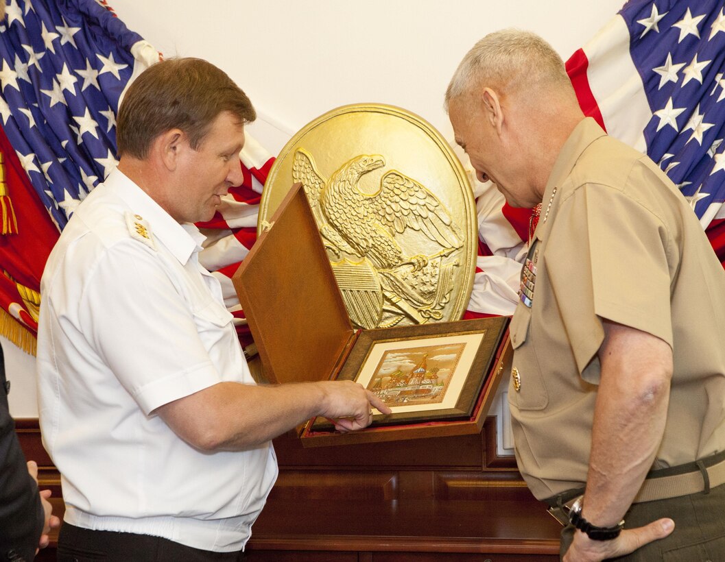 The Chief of the Russian Navy, Admiral Victor Chirkov, left, gives a ...