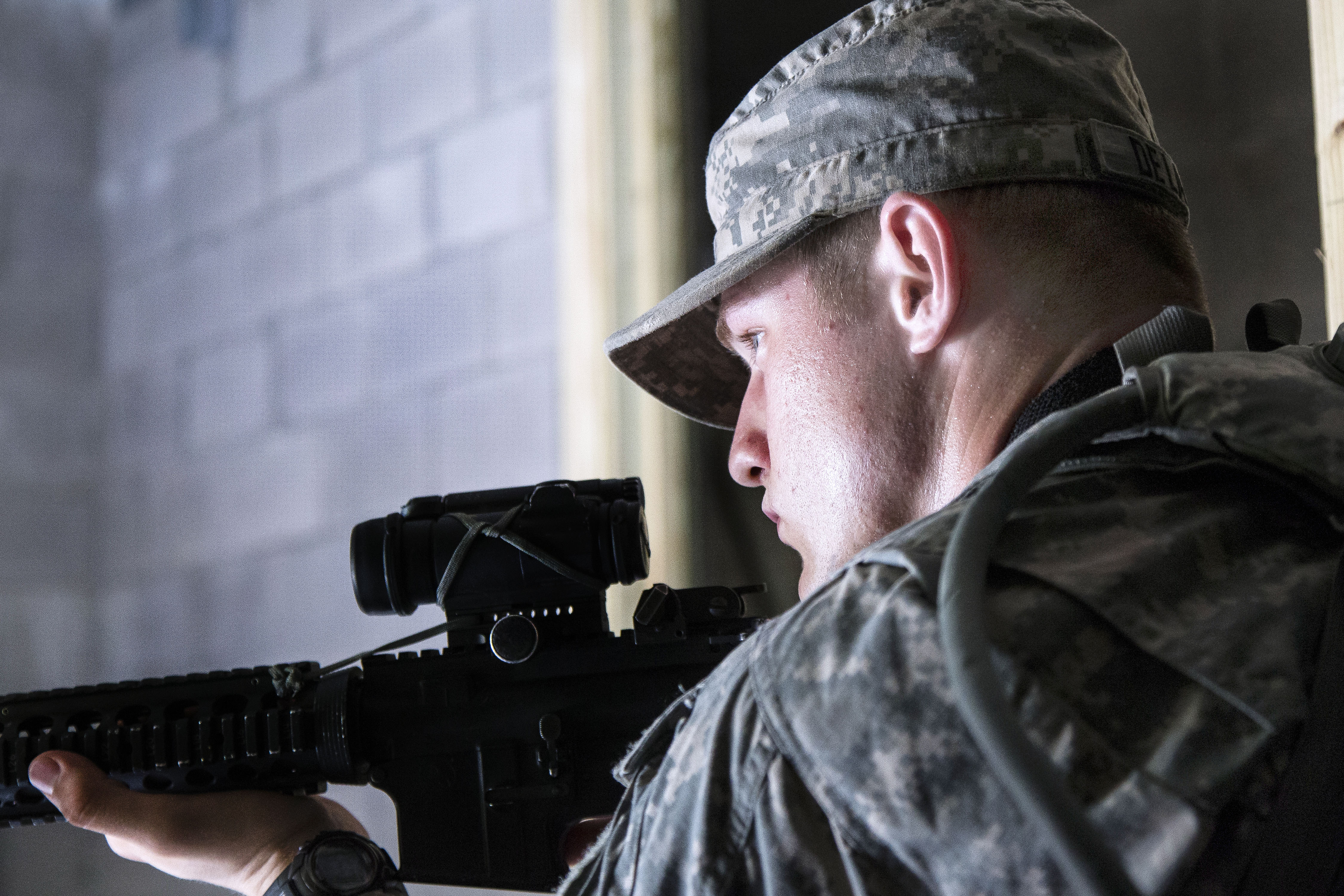 A U.S. Military Academy cadet provides security while other cadets ...