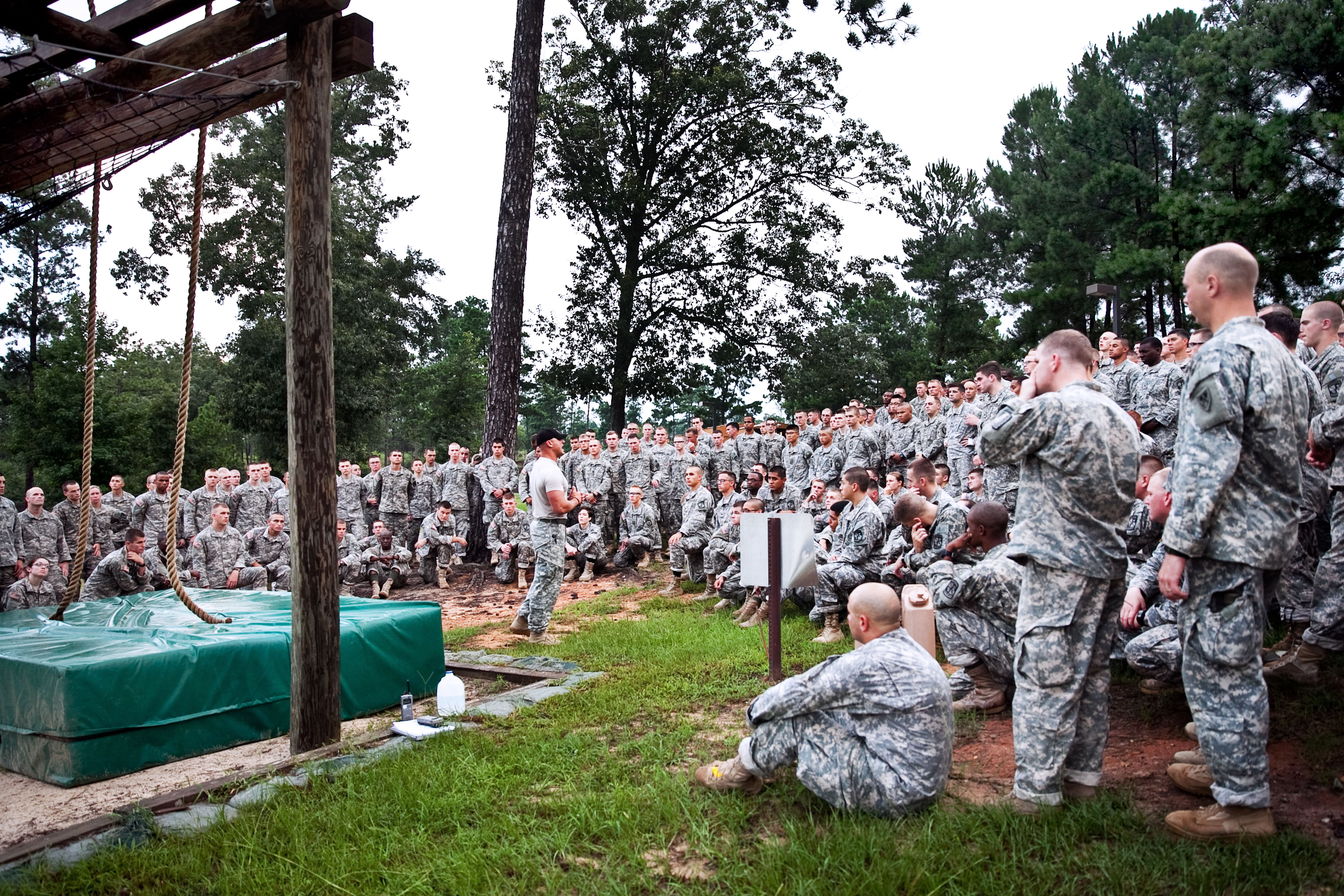 Army Staff Sgt. Derek Koth, center, explains how to negotiate the ...