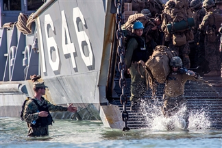 U.S. Marines from the 31st Marine Expeditionary Unit wade ashore