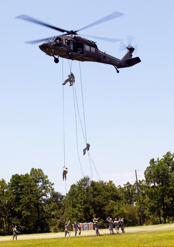 Soldiers and Army cadets rappel out of a UH-60 Black Hawk helicopter ...