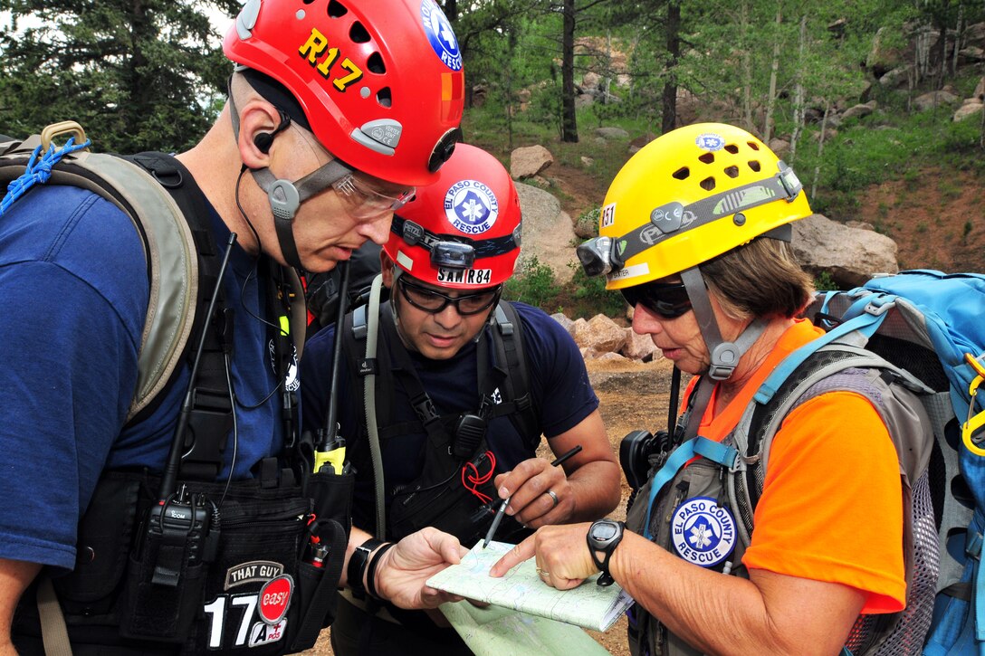 El Paso County search and rescue members Eric Babcock, left, Sam ...