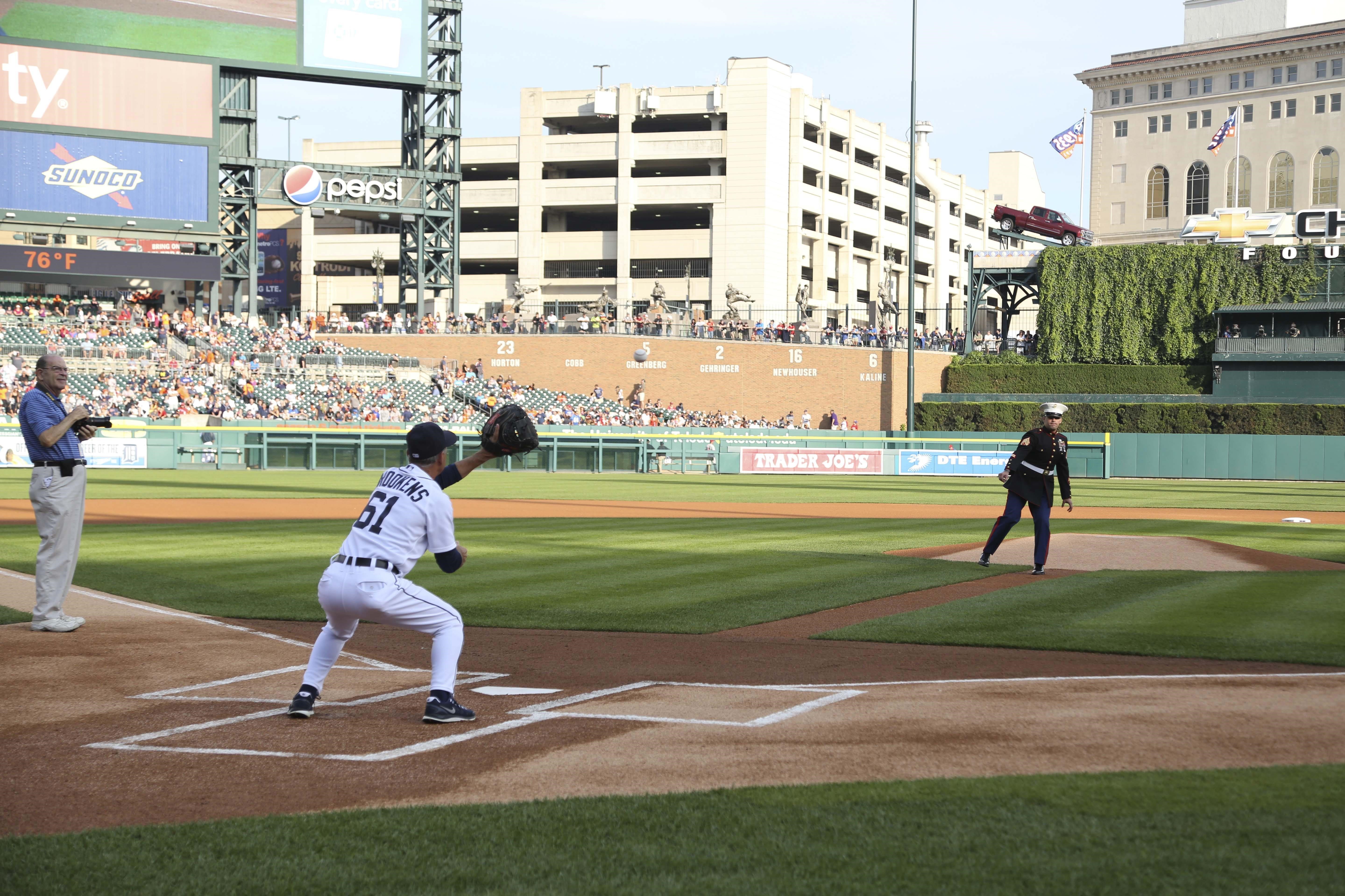 U.S. Marine Corps Staff Sgt. Dominic Freda throws the first pitch at a ...