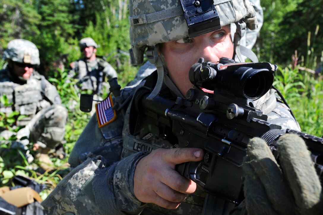 Army Pfc. Eric Leow provides security as the point man while fellow ...