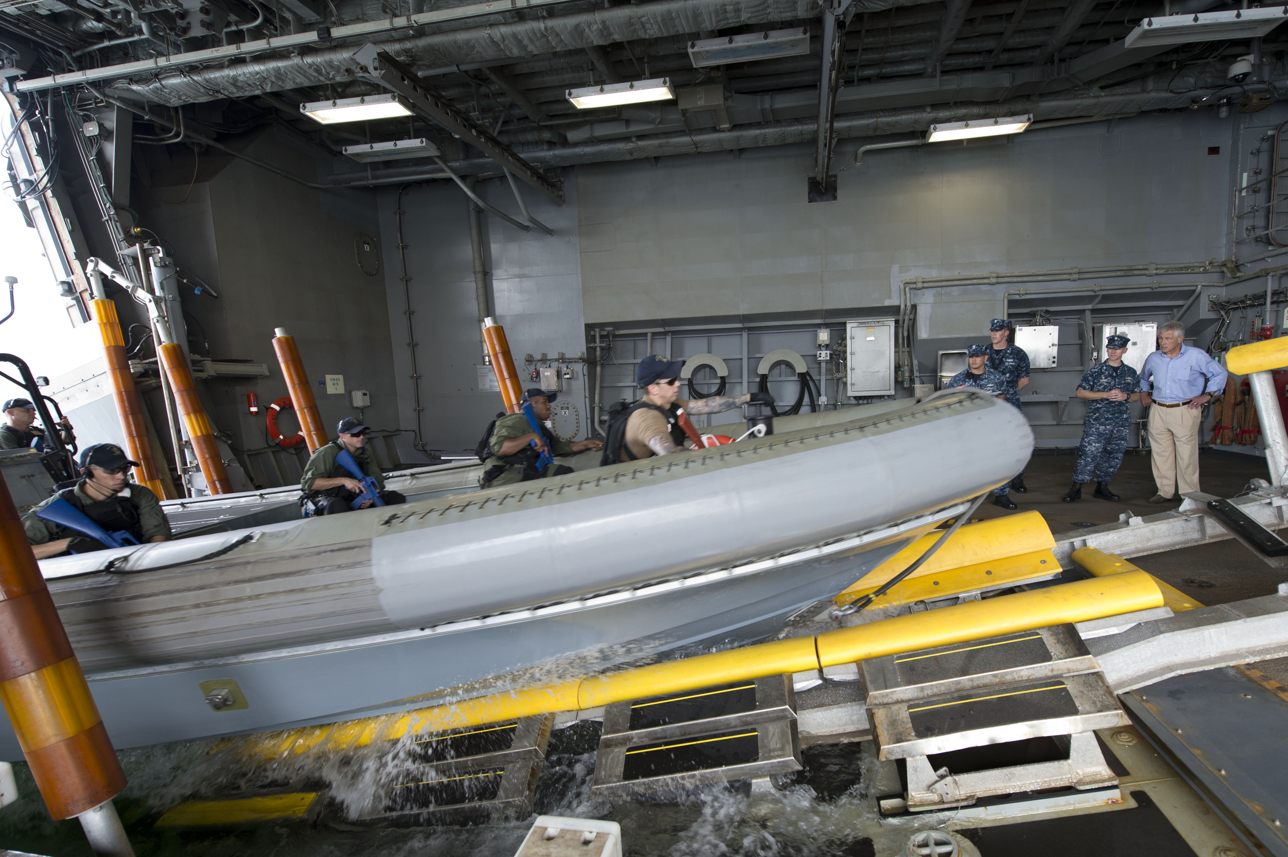 U.S. Defense Secretary Chuck Hagel watches a waterborne mission ...