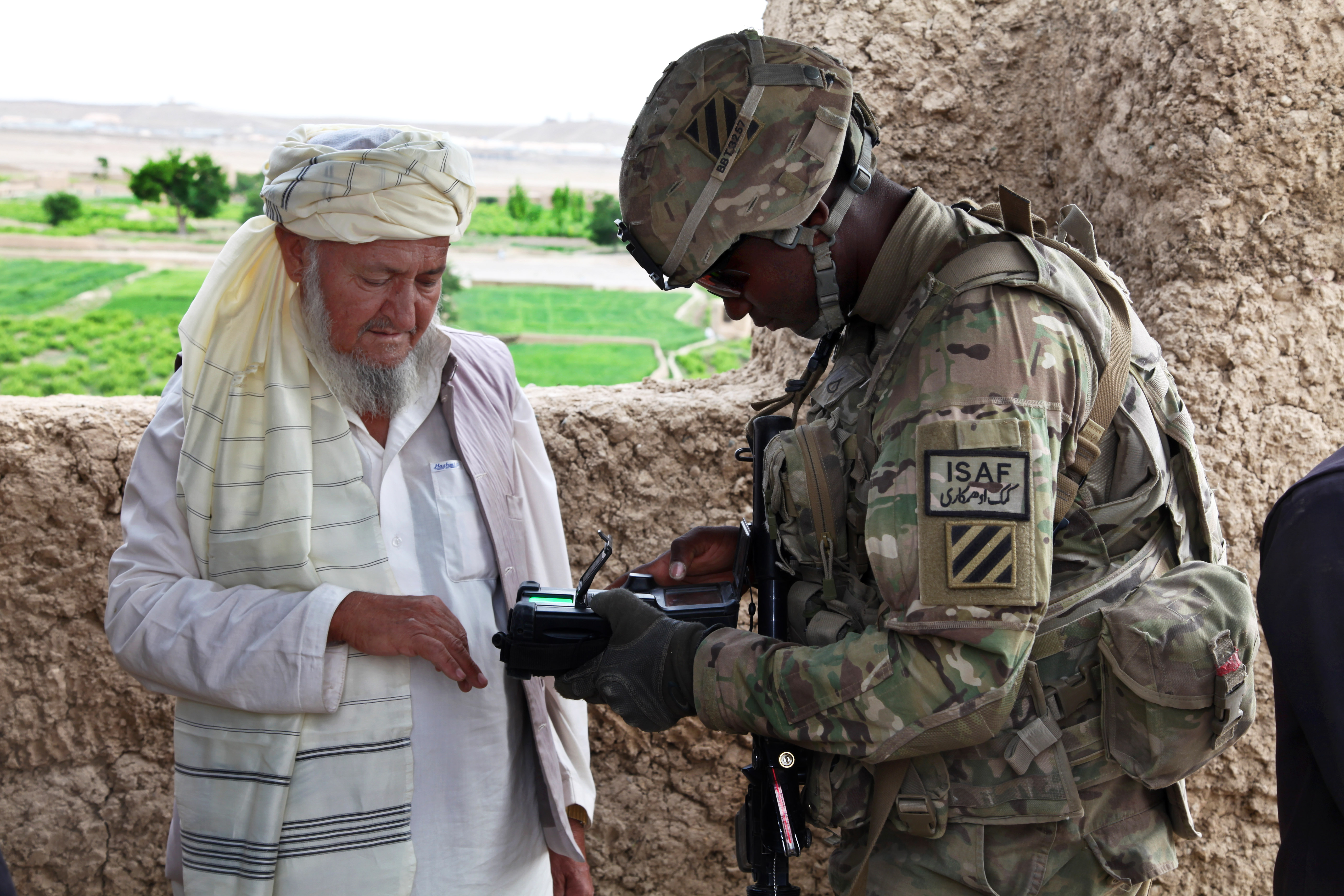 U.S. Army Pfc. Nate Tillman identifies a local villager near Forward ...