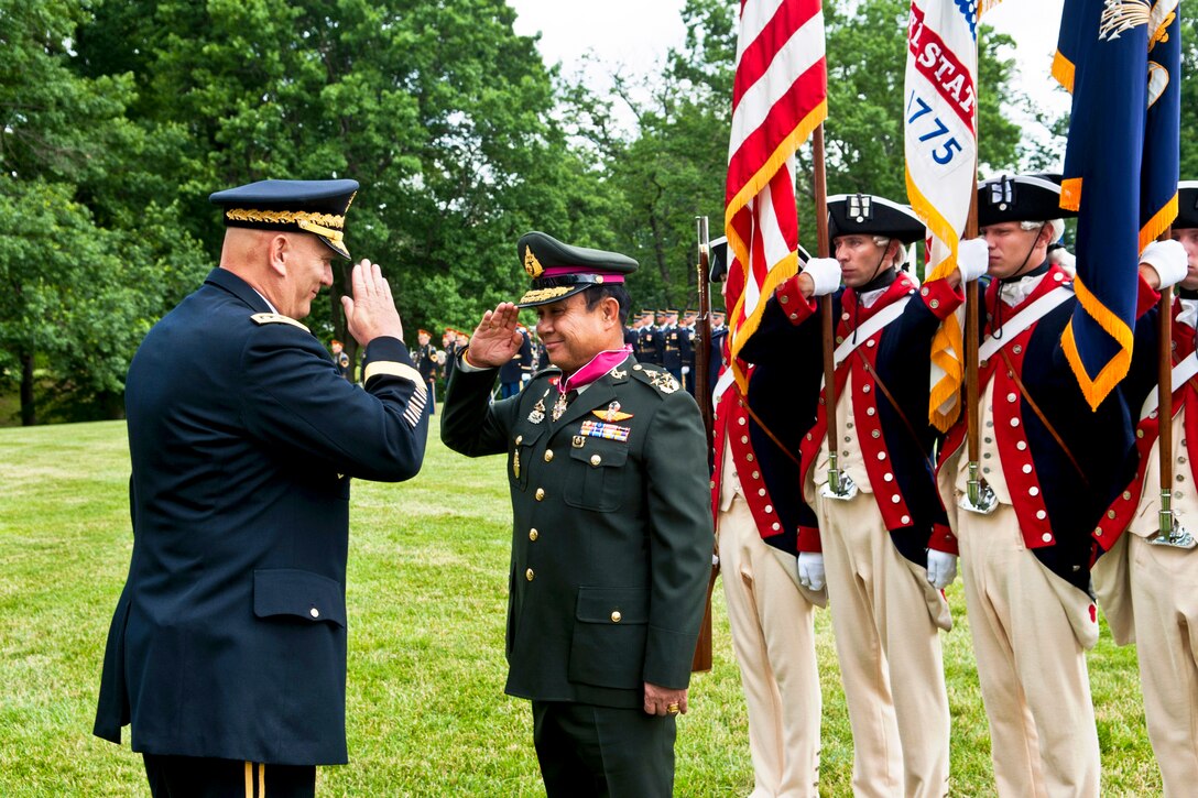 U.S. Army Chief of Staff Gen. Ray Odierno, left, salutes Thai army Gen ...