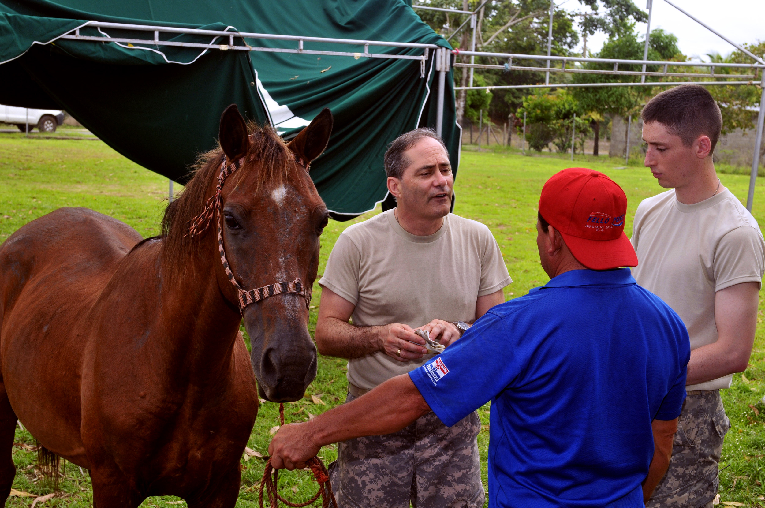 U.S. Army Capt. John Turco, left, speaks with a Panamanian man after he ...