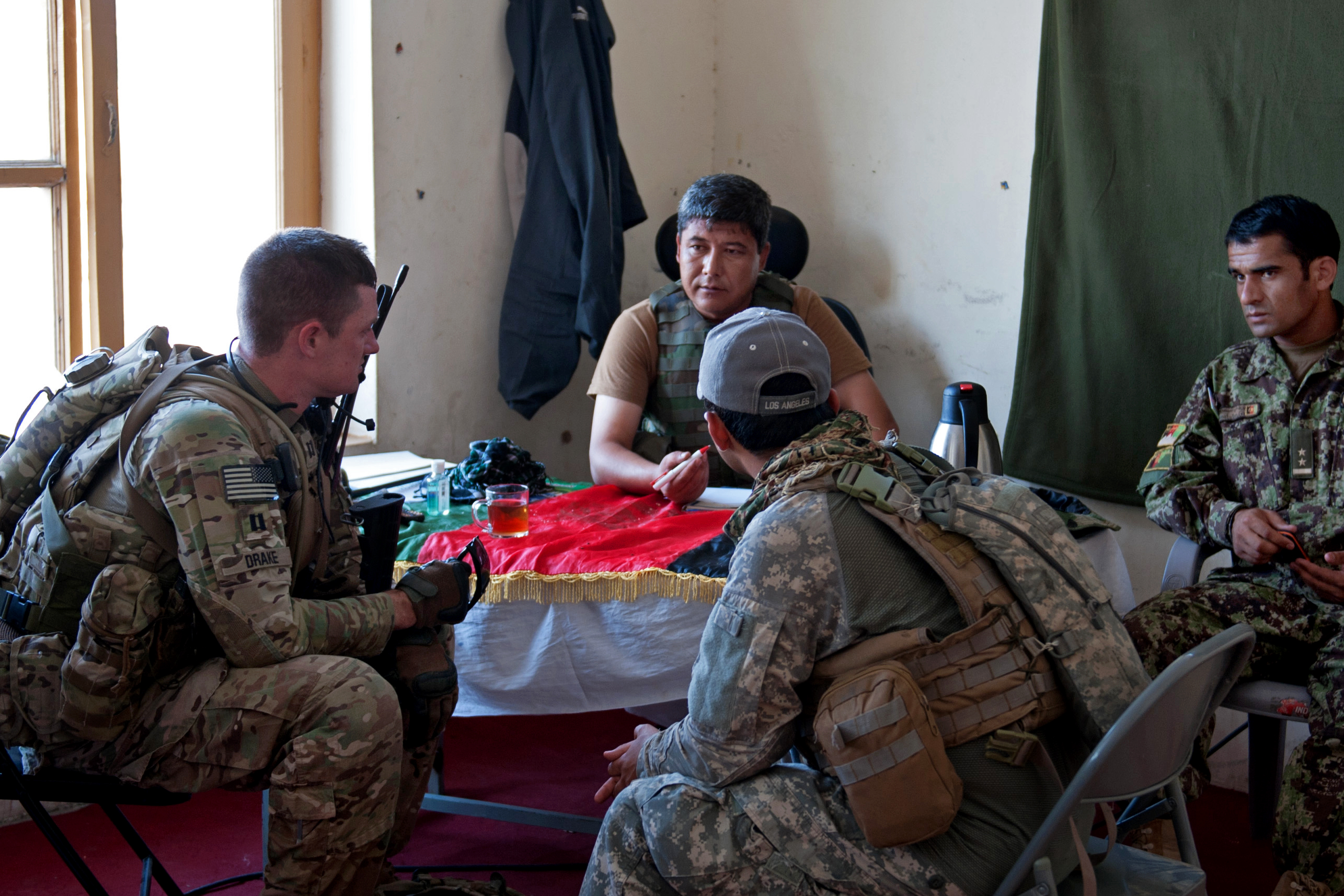 U.S. Army Capt. Nicholas Drake, left, talks with Afghan army Lt. Col ...