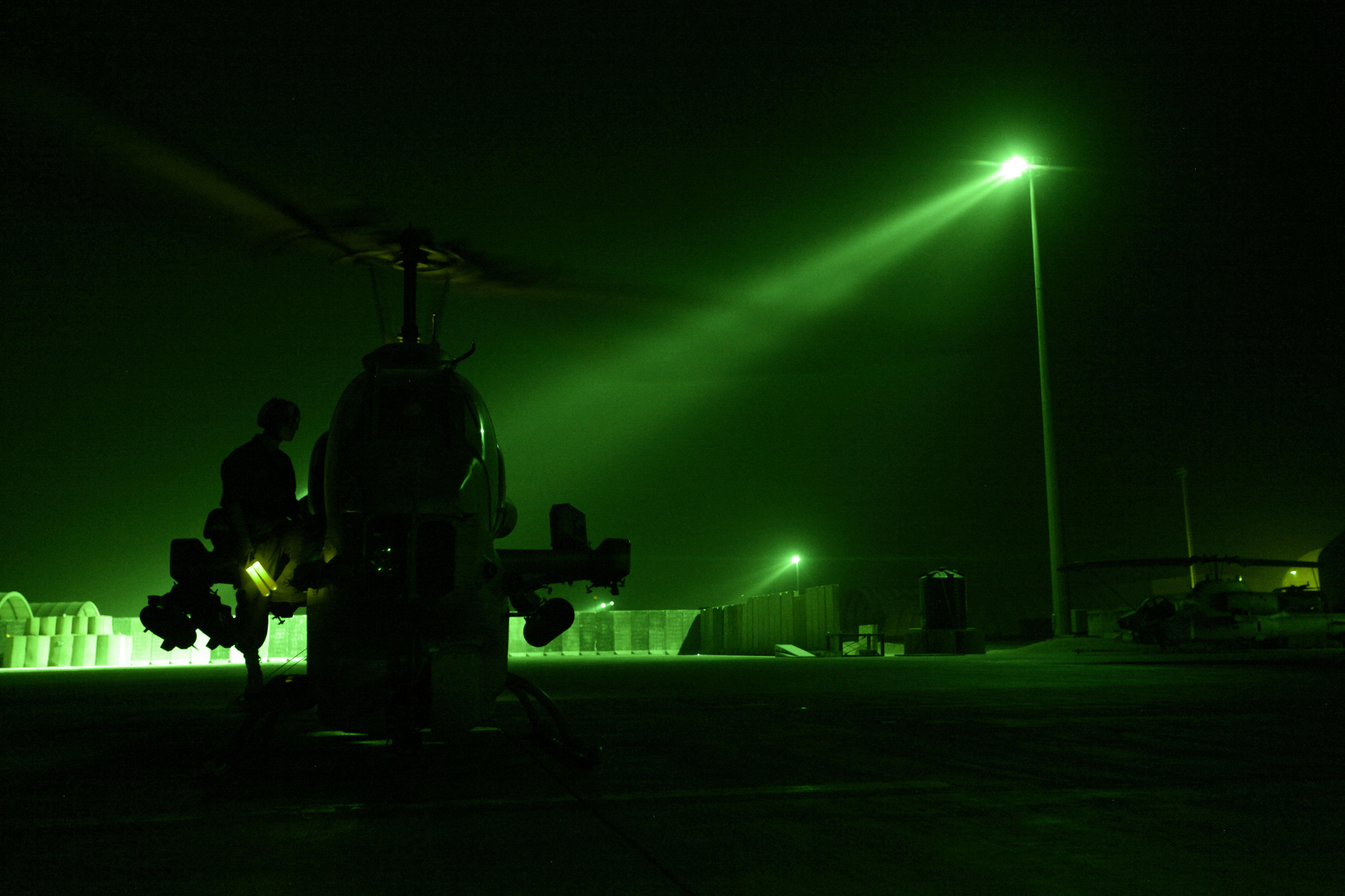 As seen through a night-vision device, U.S. Marine Corps Cpl. Philip A ...