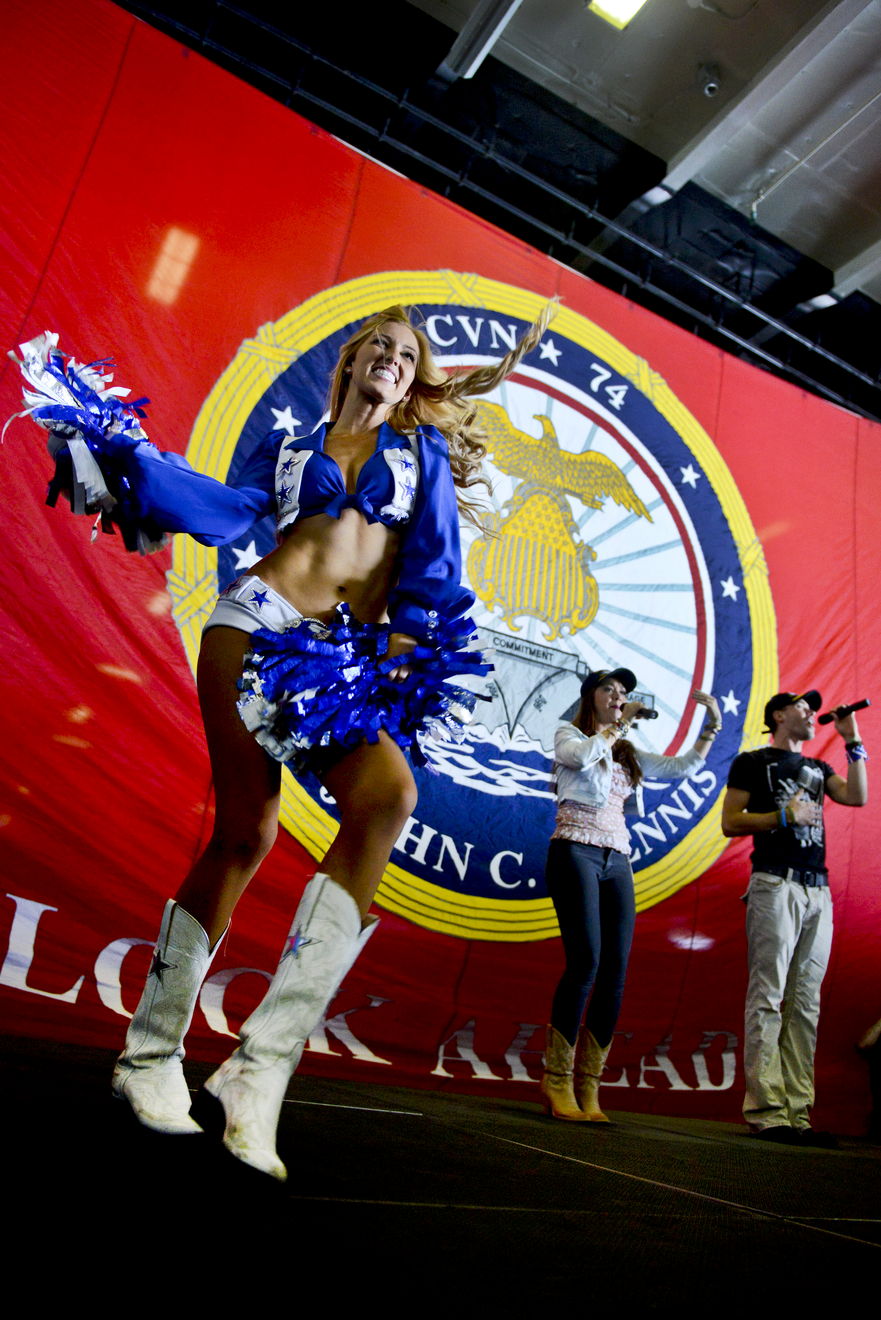 Dallas Cowboy cheerleader Cassie Trammell, left, dances as American ...
