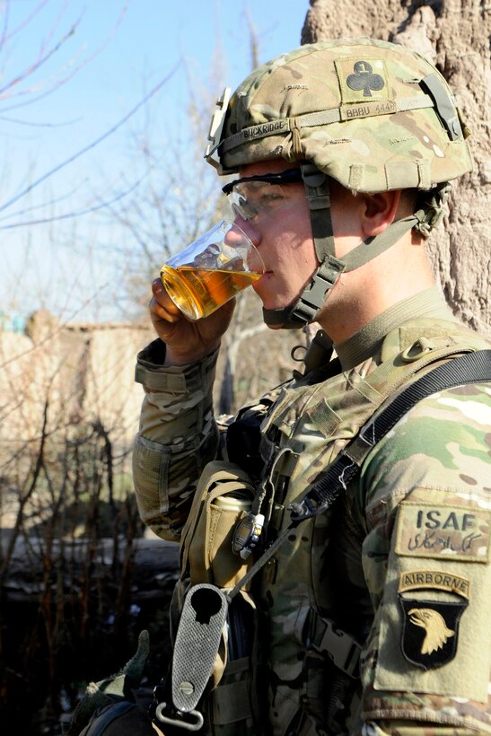 U.S. Army Pfc. Jonathan Buckridge drinks chai tea while providing ...