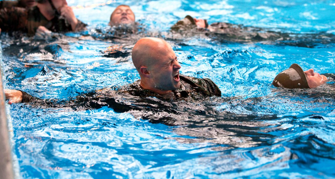 Marine Corps Master Sgt. Robert Moates completes a rescue drill during ...