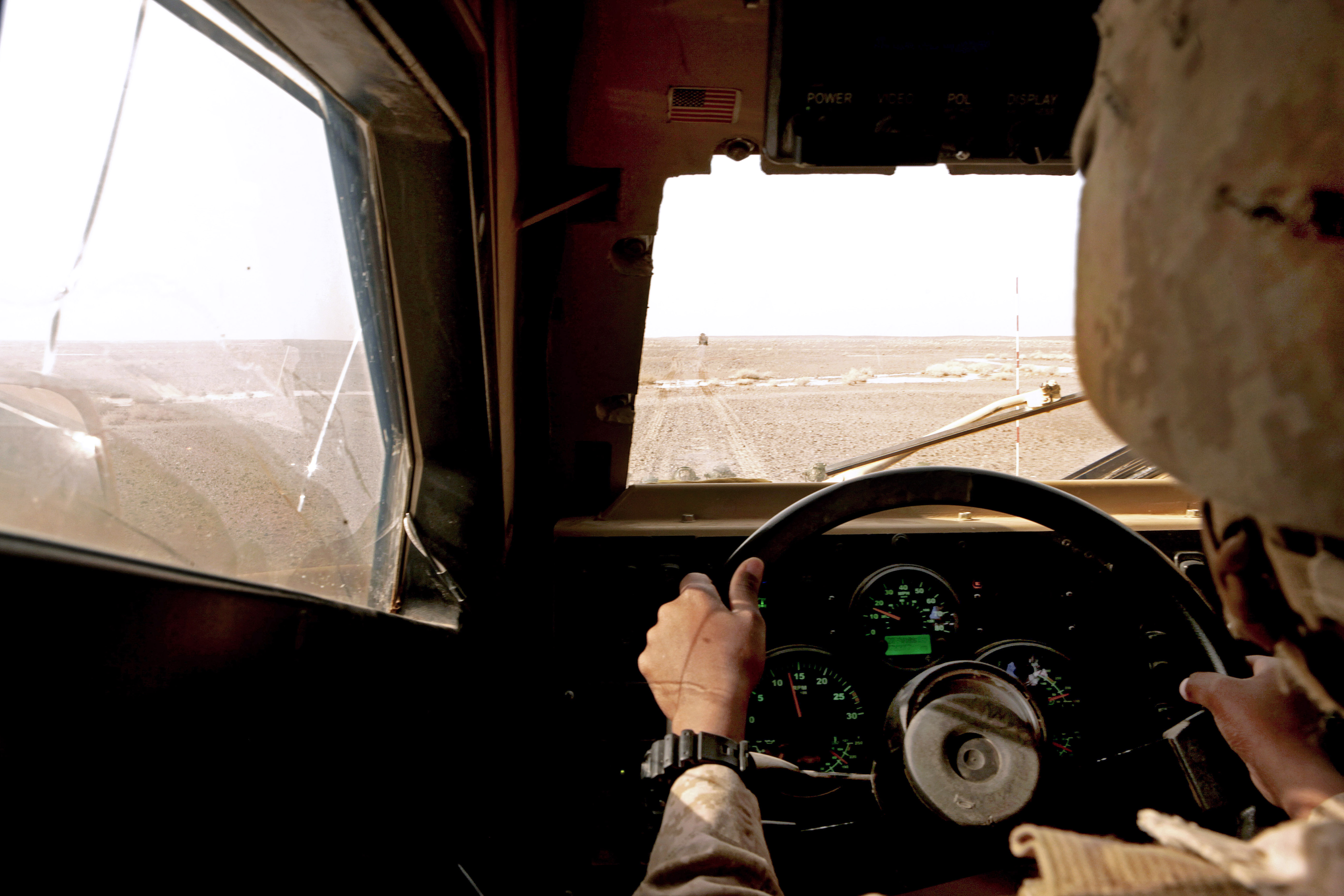 U.S. Marine Corps Lance Cpl. Matasha Calhoun drives a mine-resistant ...