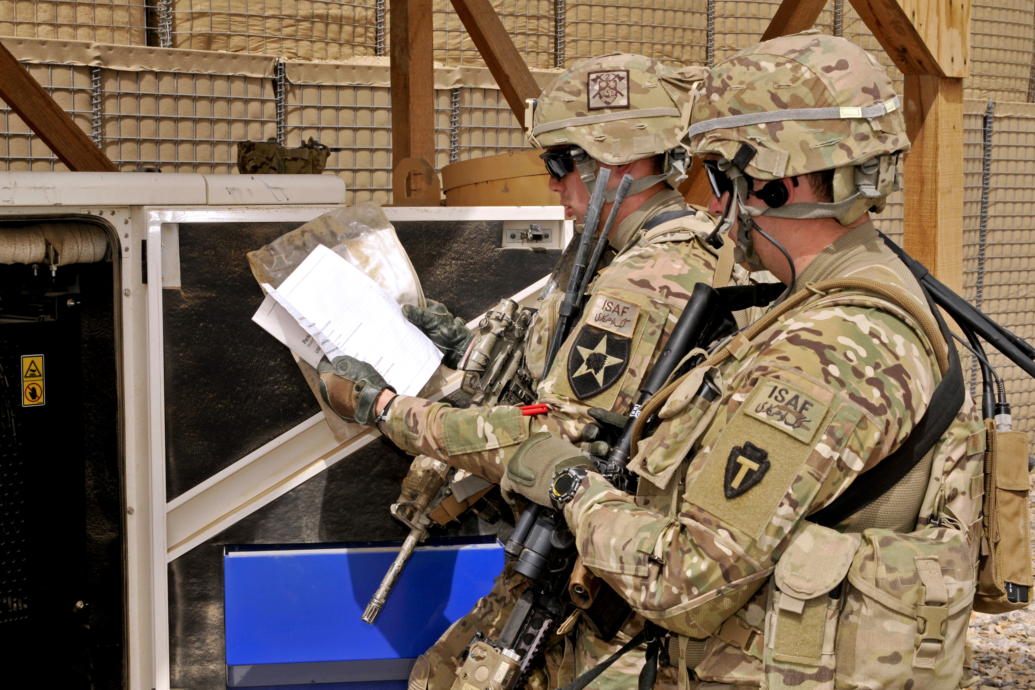 U.S. Army 1st Lt. Darren C. Bliler, left, and U.S. Army Sgt. David A ...