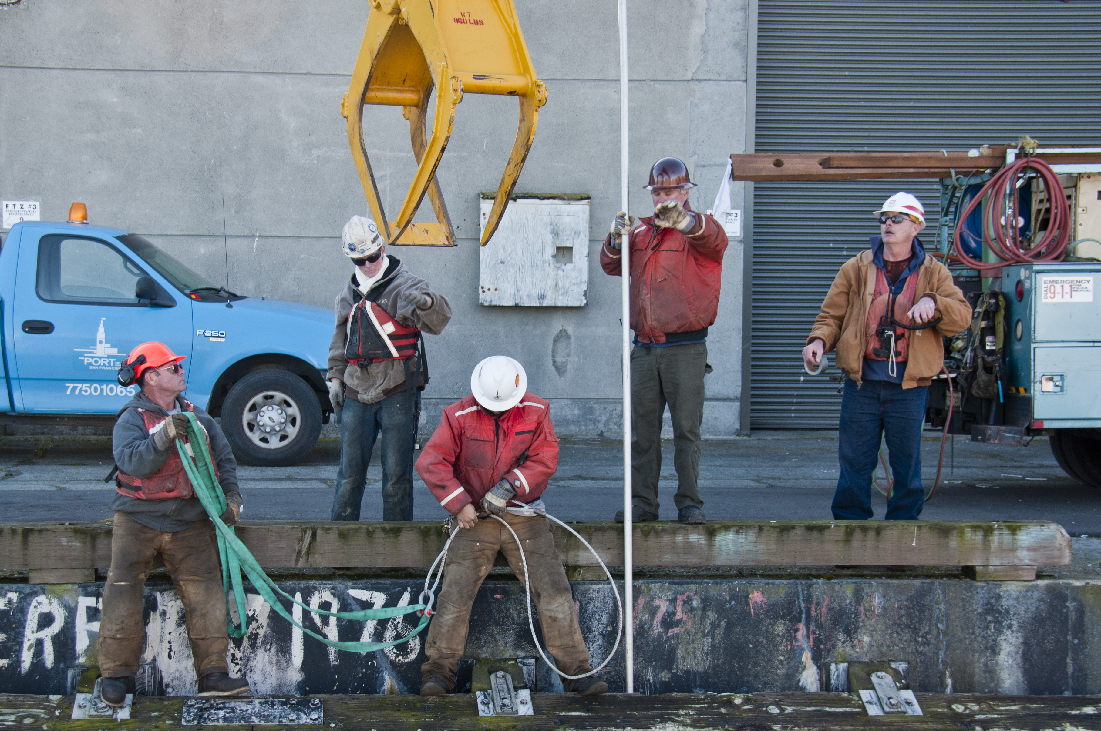 SPN crew members clear out debris pilings at SF pier for America’s Cup ...