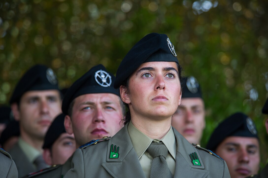Italian army officers observe Italian soldiers conduct cavalry ...