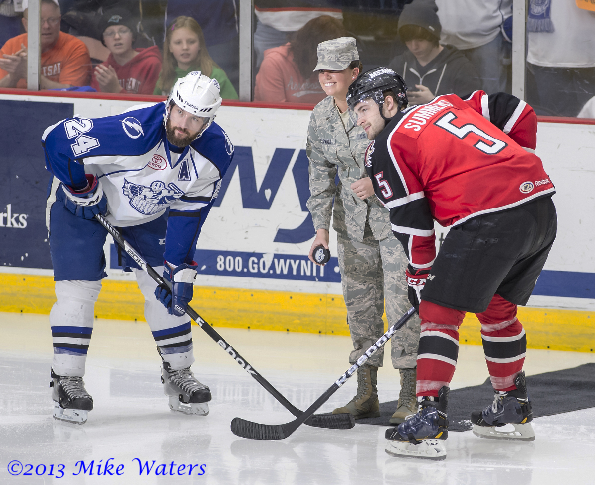 Hancock Field Airman drops ceremonial first puck