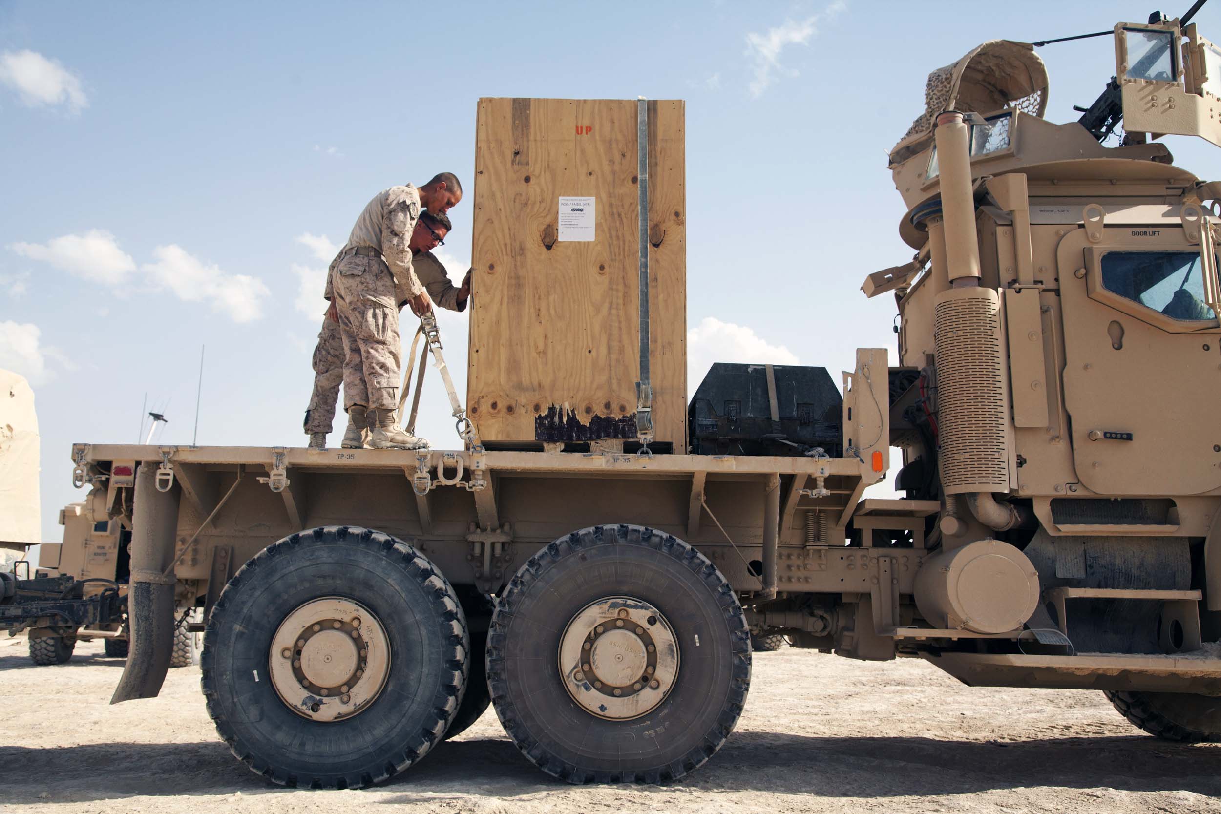 U.S. Marine Corps Lance Cpl. Joshua Brandenburg, front, and Marine ...