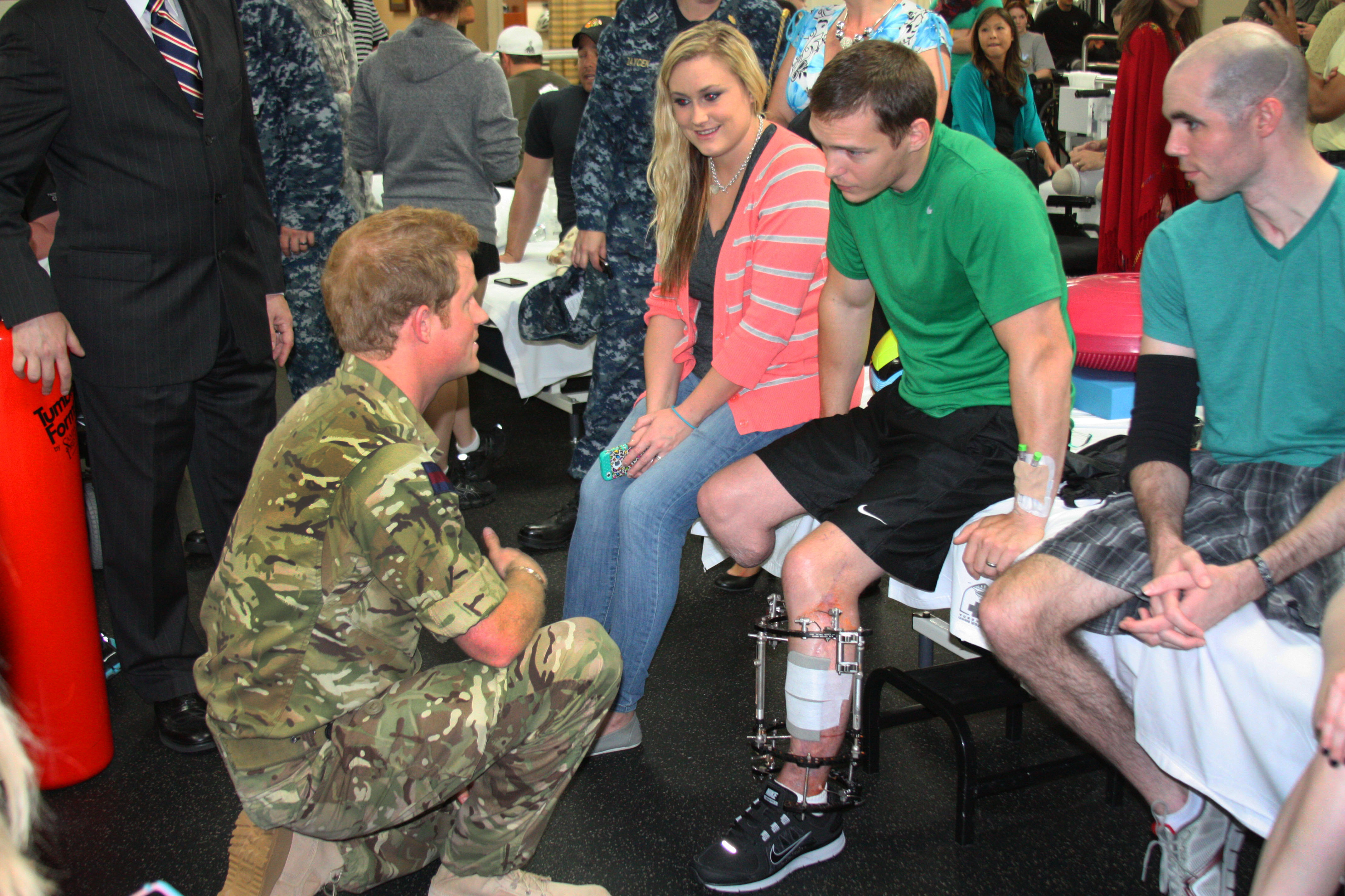 Britain’s Prince Harry speaks with U.S. Army Spc. Eric Hunter, who was ...