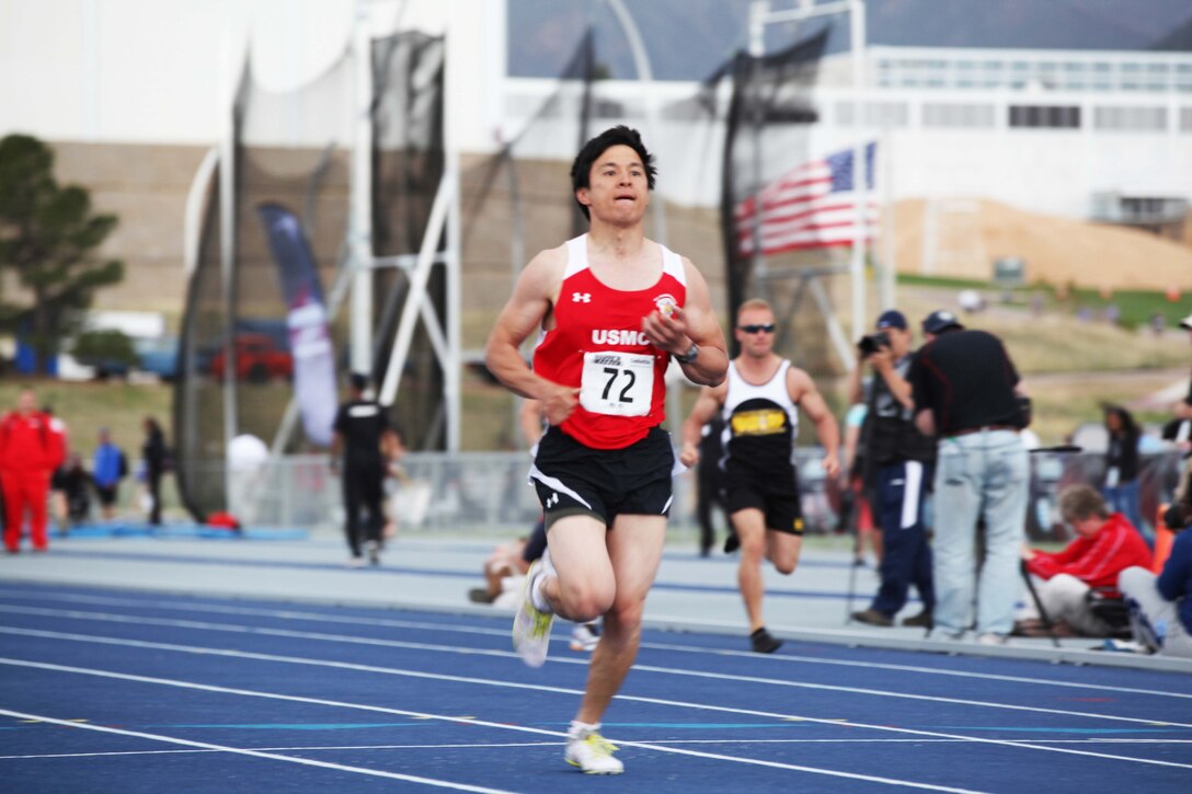 Marine Corps Capt. Derek Liu gains a lead during the 2013 Warrior Games ...