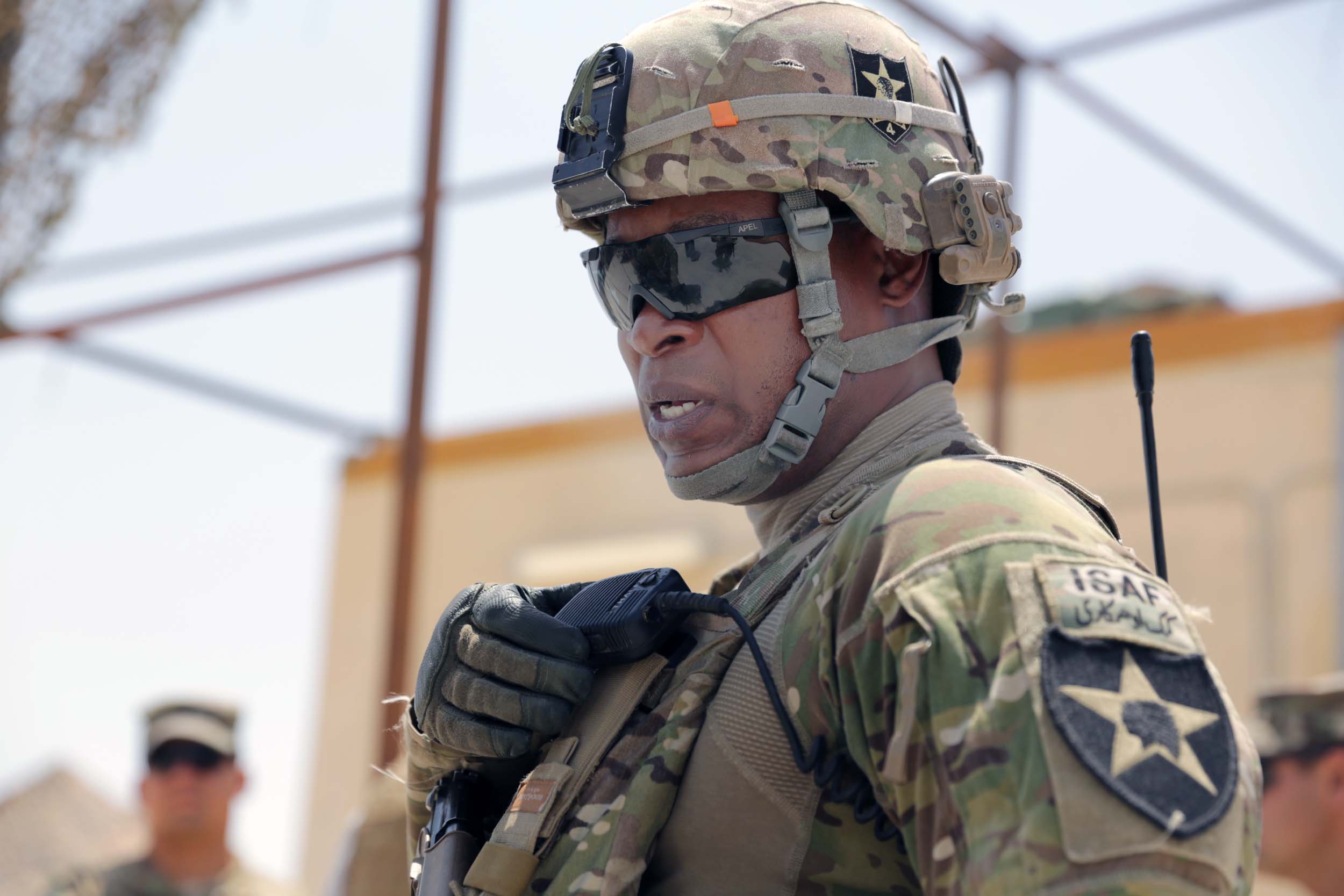 U.S. Army Staff Sgt. Roderick Cooper checks radio communications prior ...