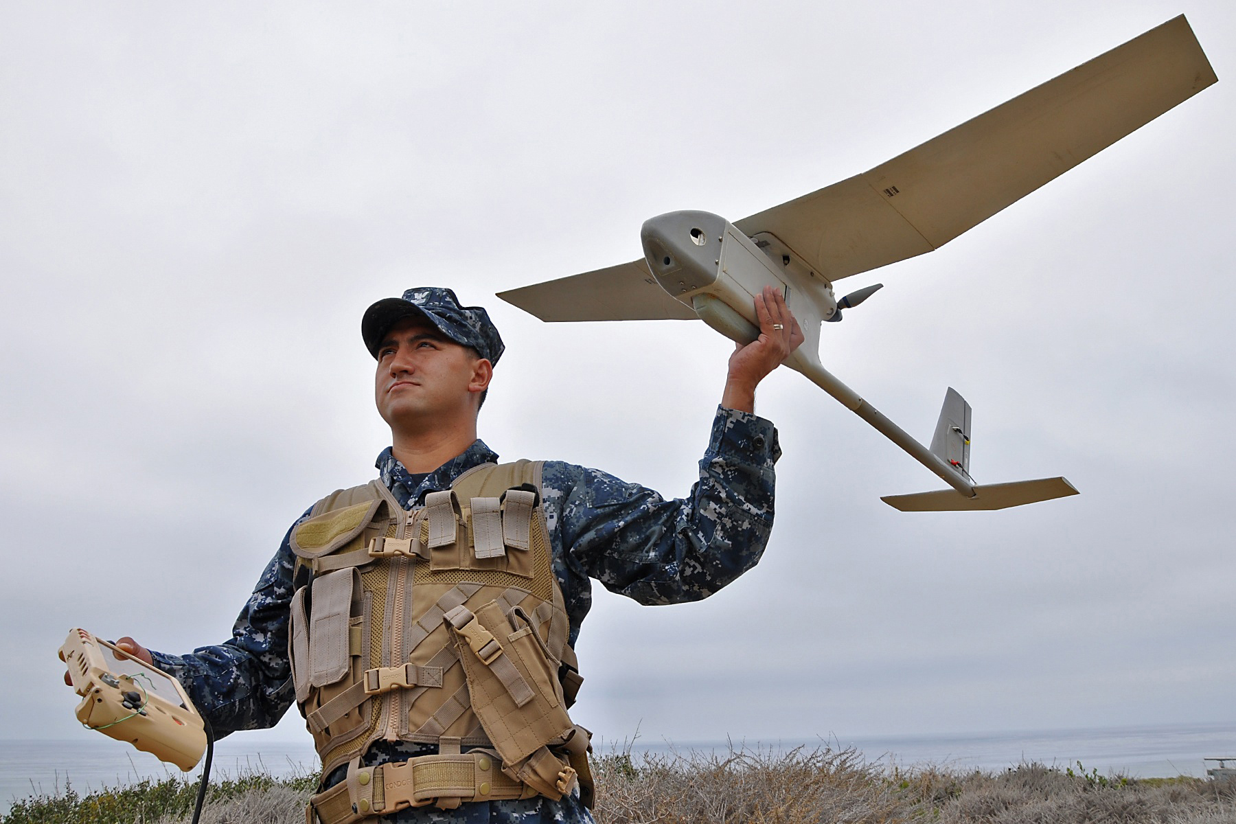 Navy Petty Officer 1st Class James Galvan prepares to launch a Raven ...