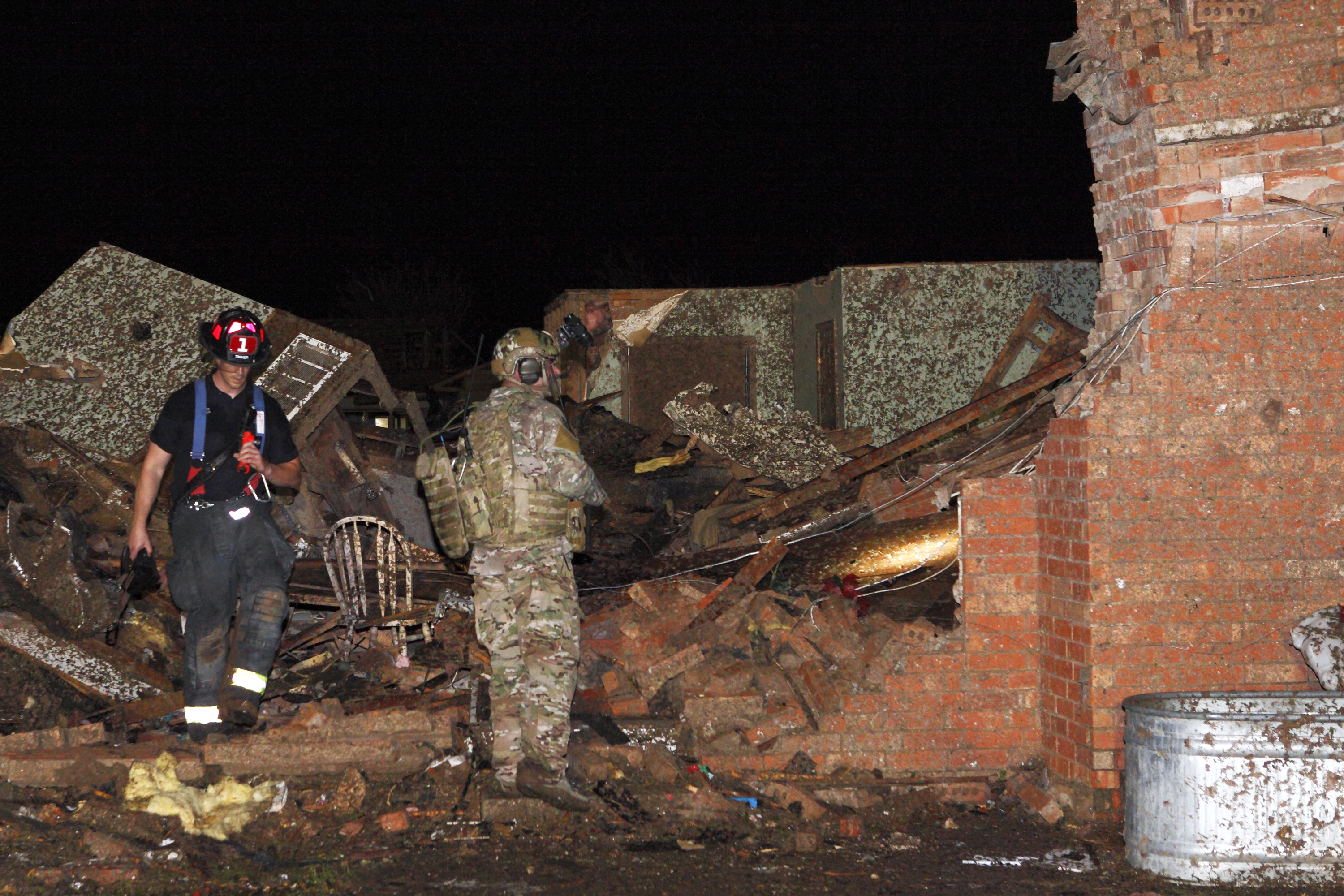 An Oklahoma National Guard soldier and firefighter search for survivors ...