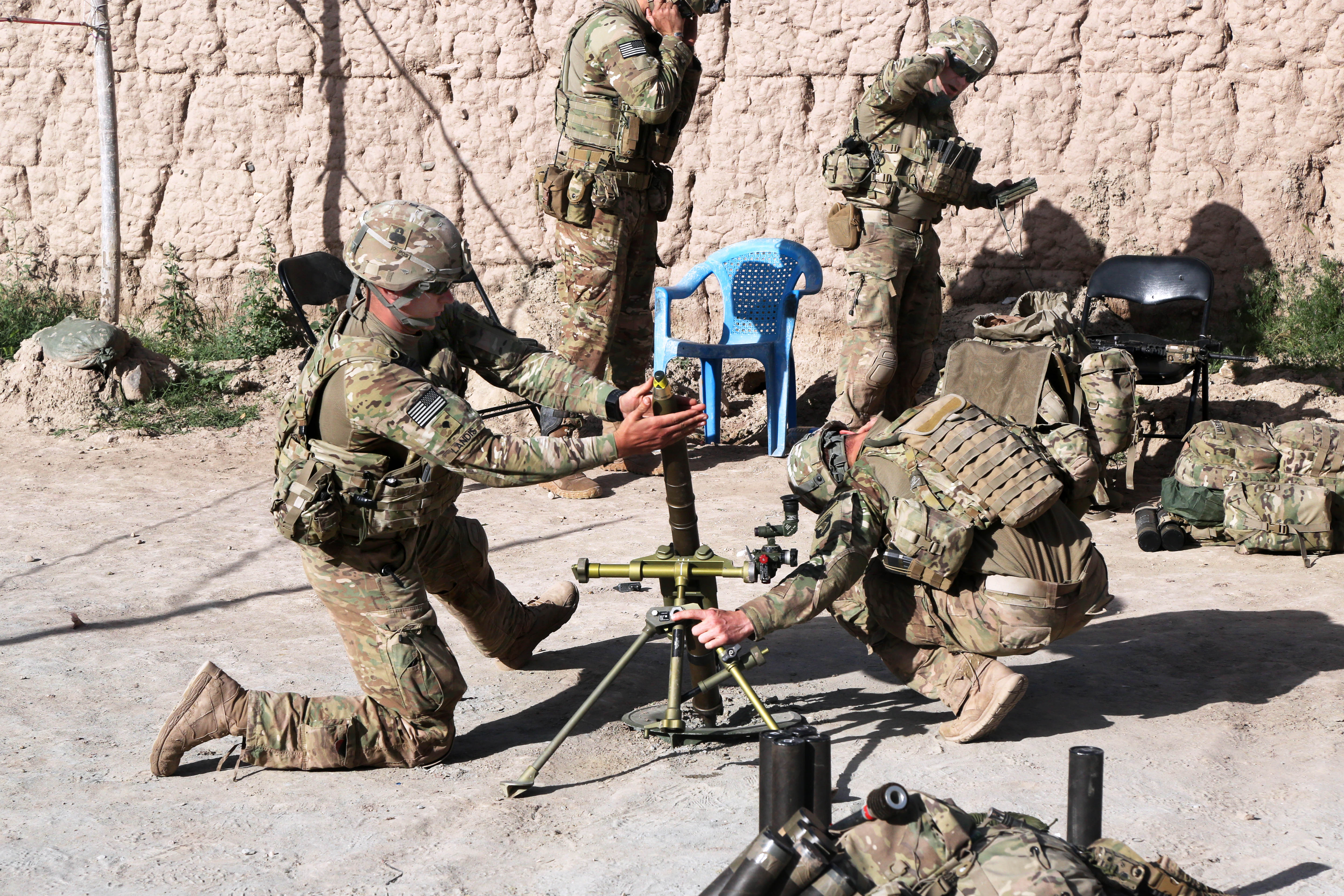 U.S. Army Spcs. Andrew Landish and Tyrel Fishe prepare to launch a ...