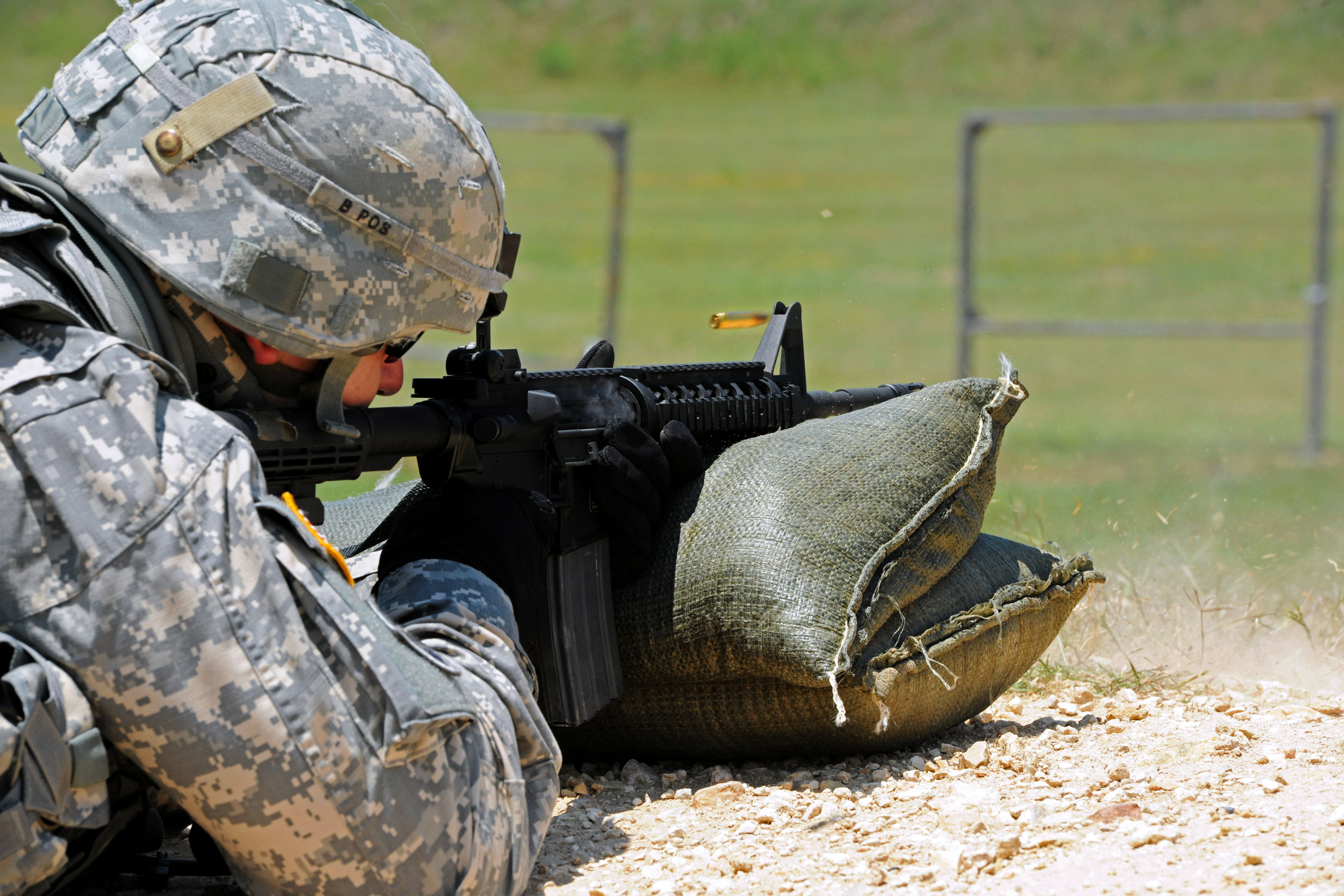 Army Sgt. Andrew French fires his M4 carbine during the 2013 U.S. Army ...